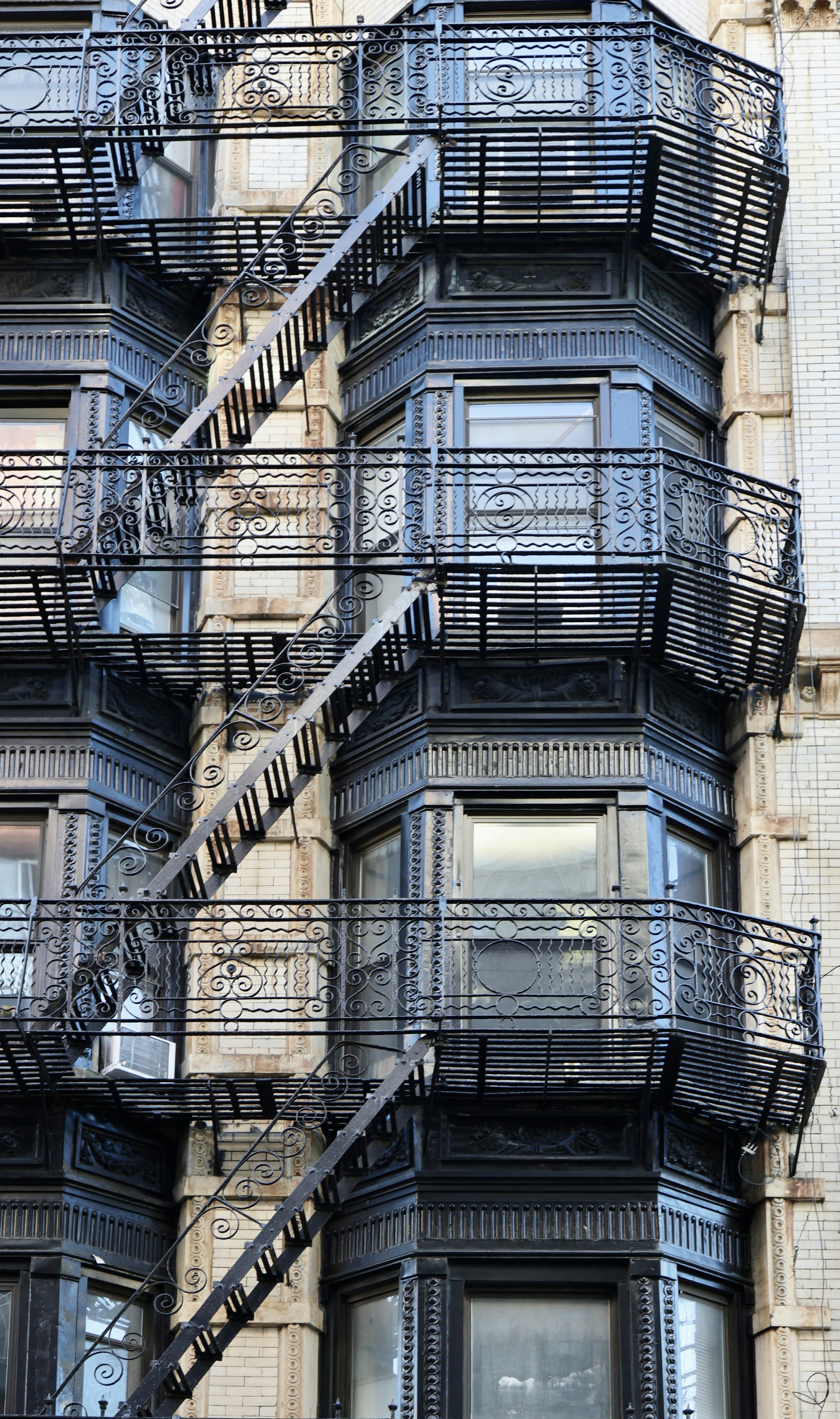A fire escape on the side of a building photo – Free Building Image on ...