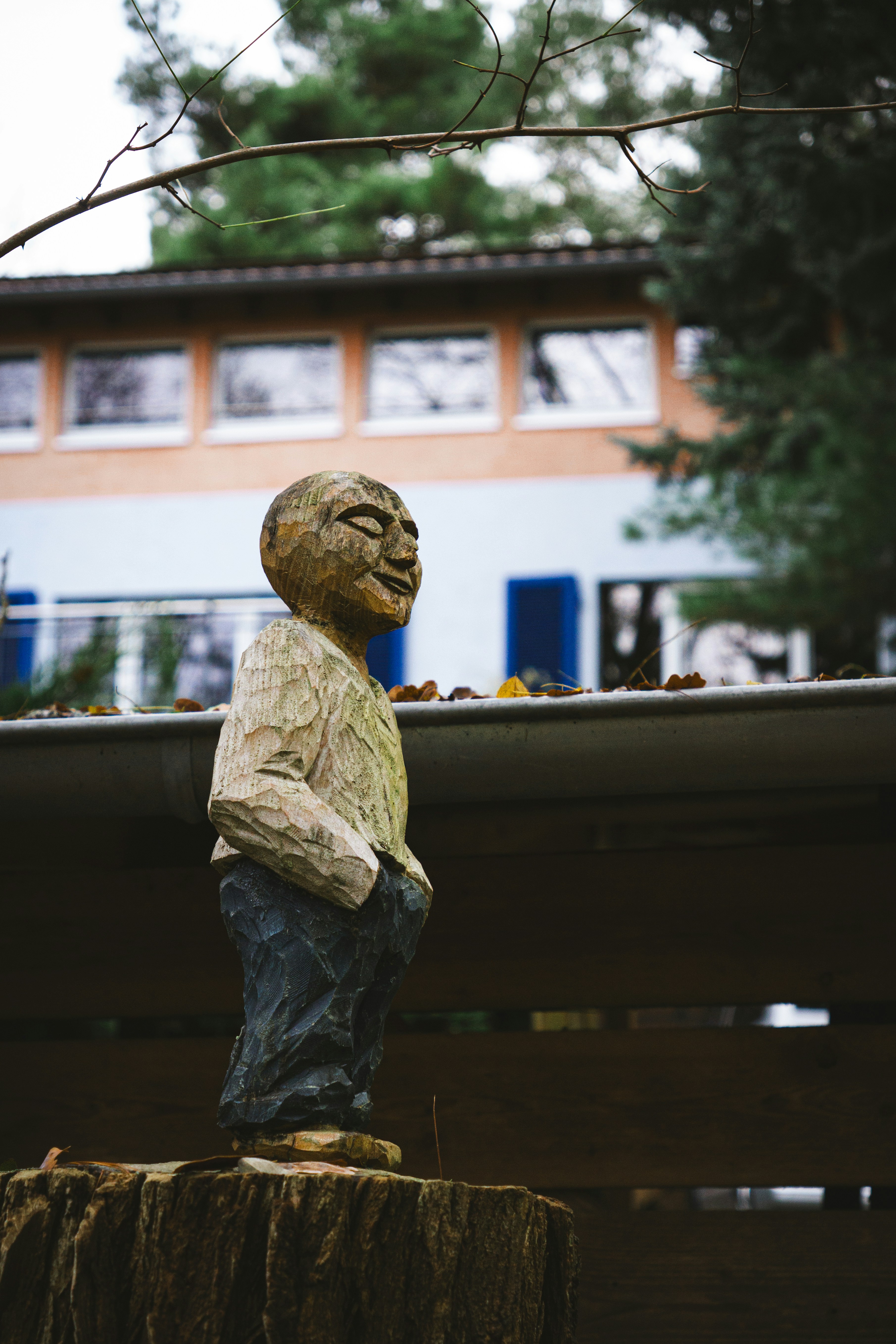 Whimsical Woodcarving Amidst Urban Tranquility