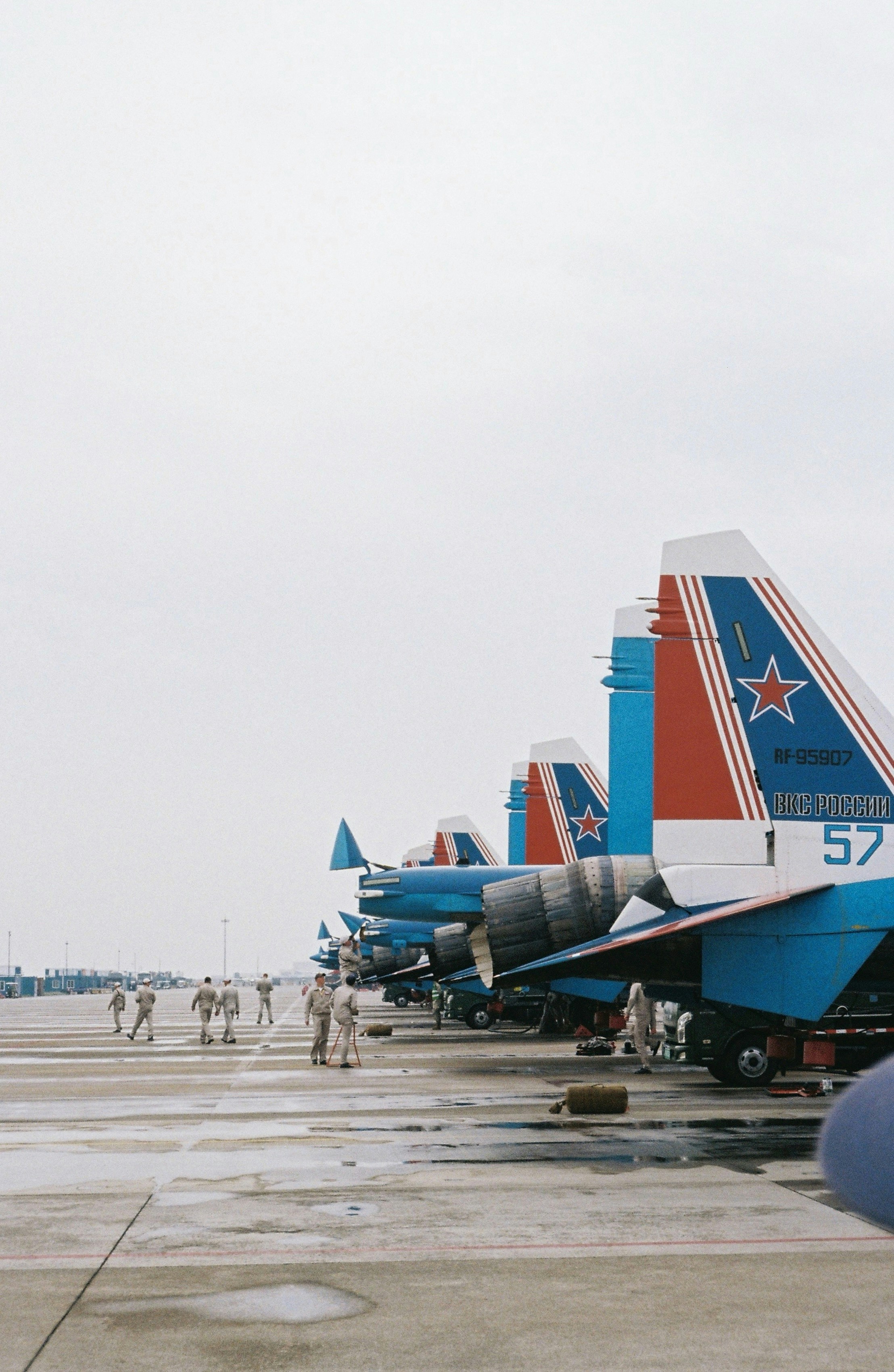 A row of fighter jets sitting on top of an airport tarmac photo – Free ...