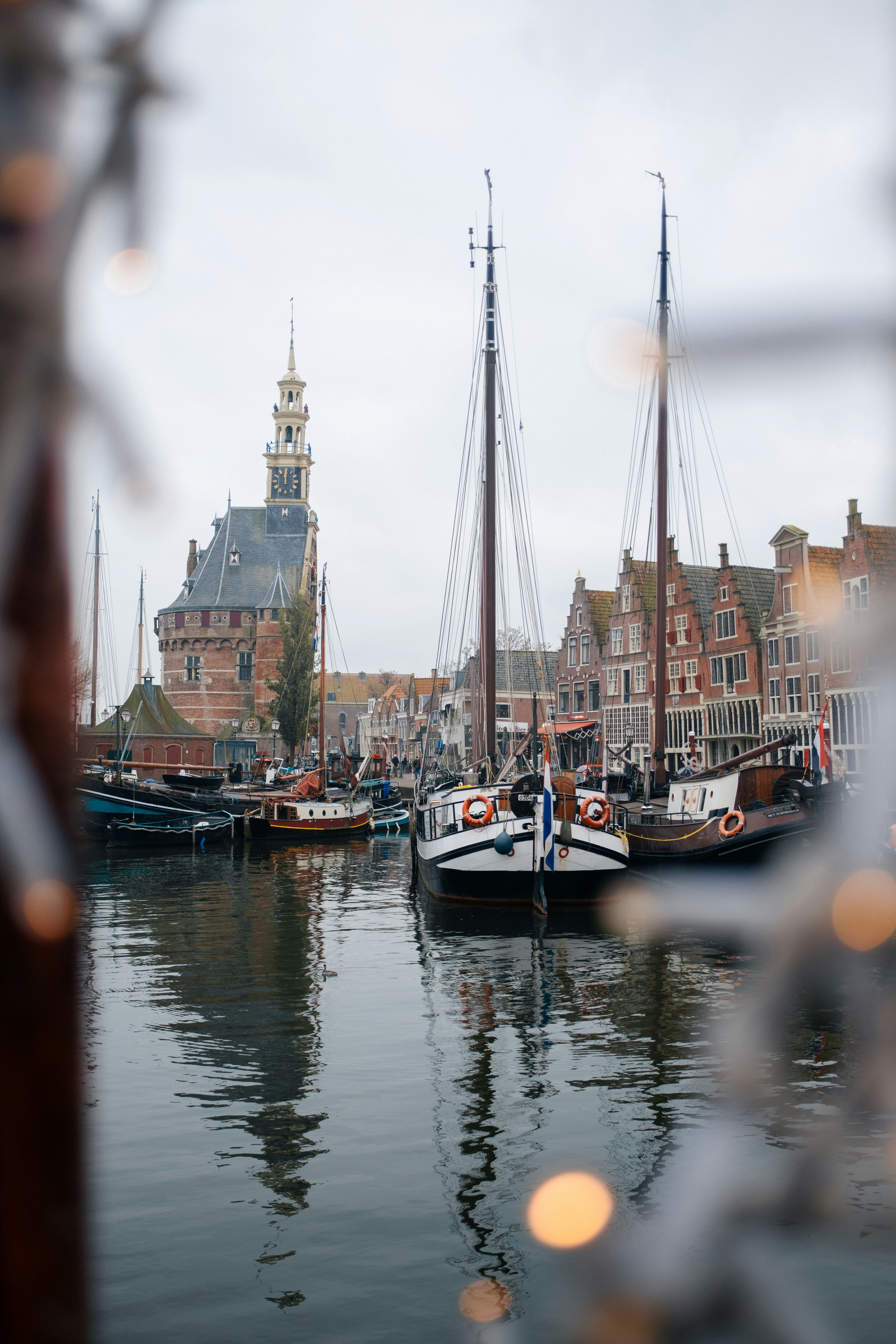 A harbor filled with lots of boats next to tall buildings photo – Free ...