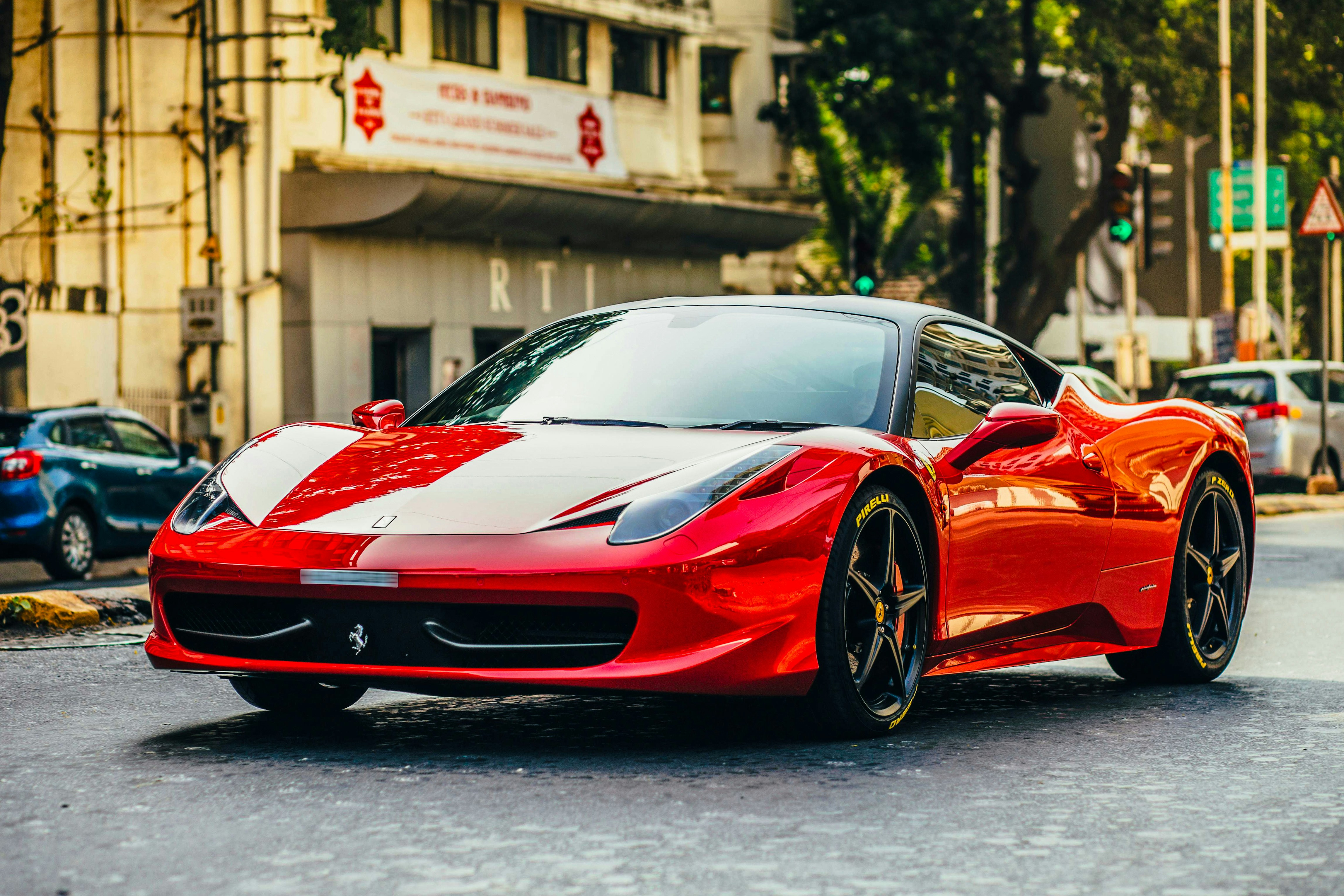 A red sports car parked on the side of the road photo – Free Sports car ...