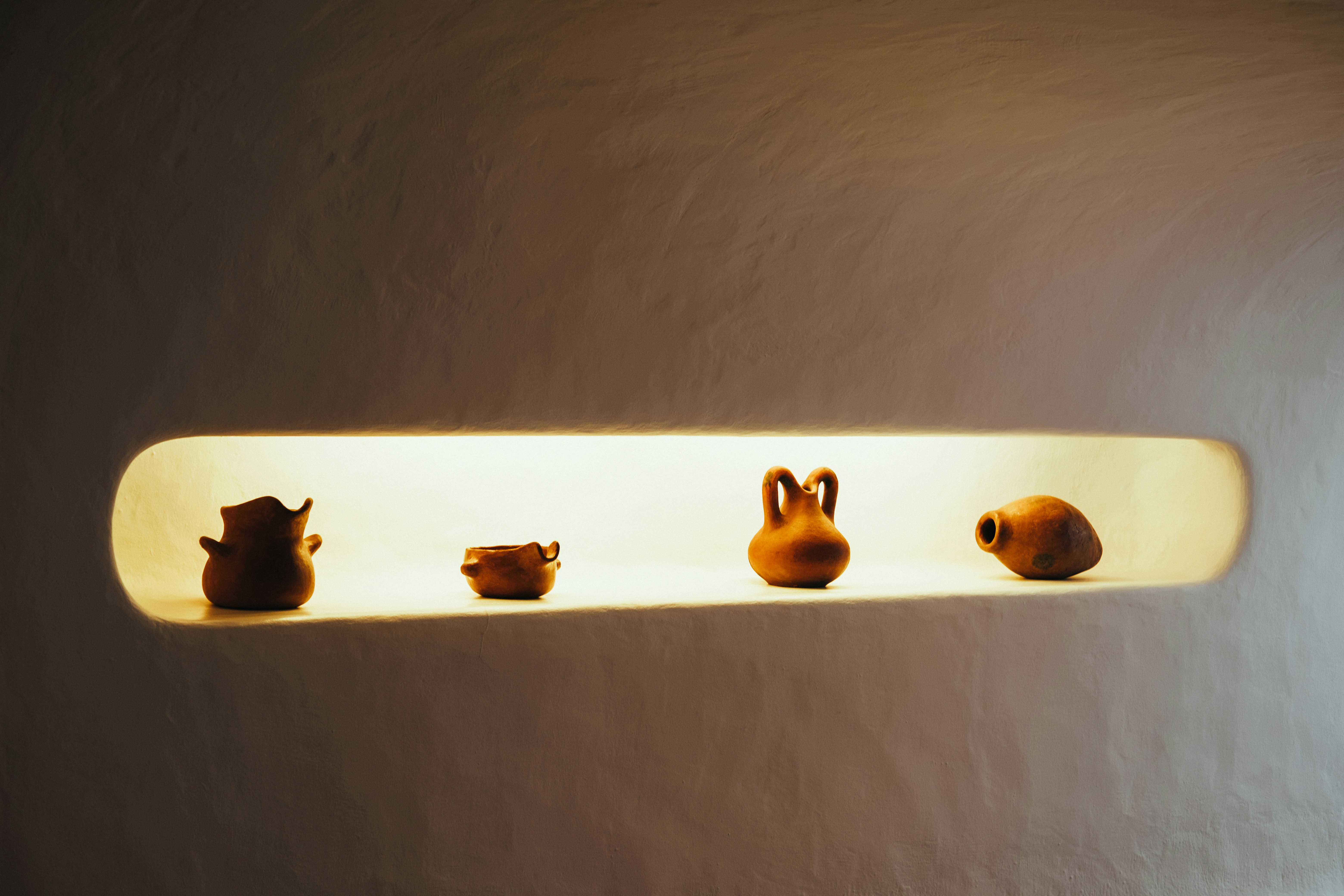 Warm Window, Tiny Companions: A Row of Four Ceramic Animals