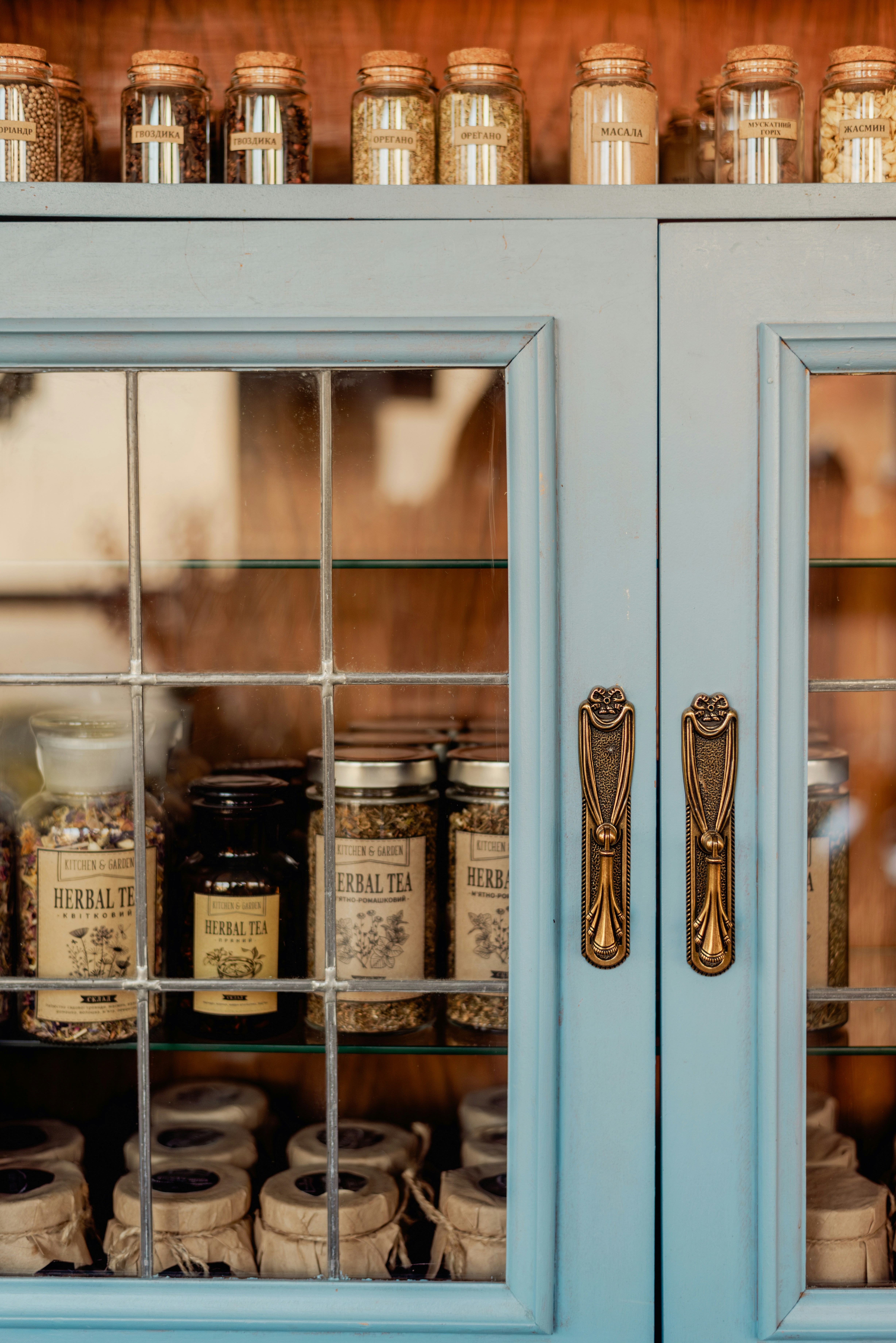 A blue cabinet filled with jars and jars photo – Free Kitchen&garden ...