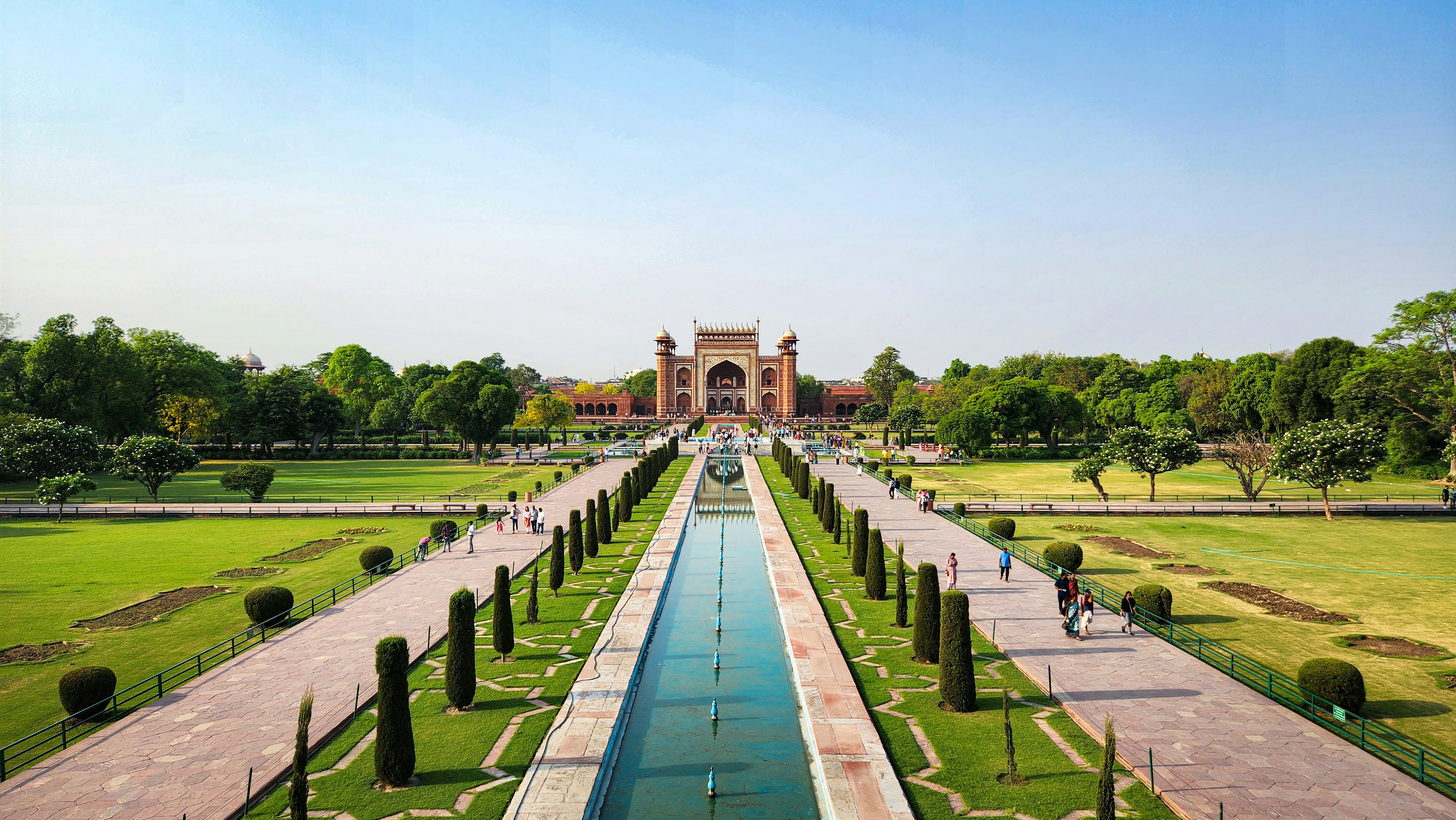 A view of a large garden with a long pool of water photo – Free India ...