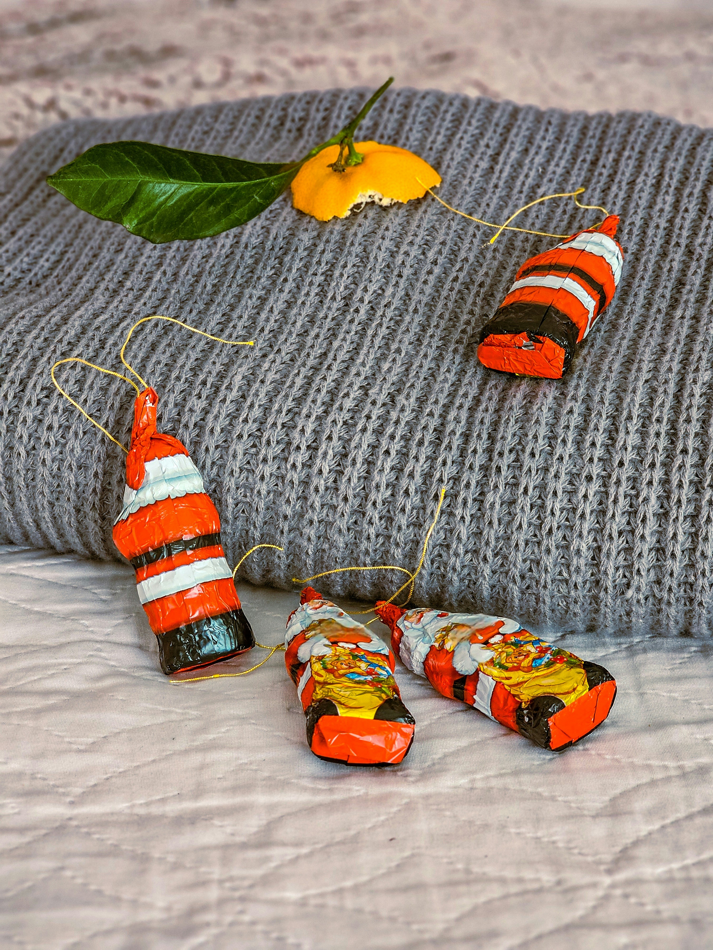 A group of orange and white striped objects on a bed photo – Free ...