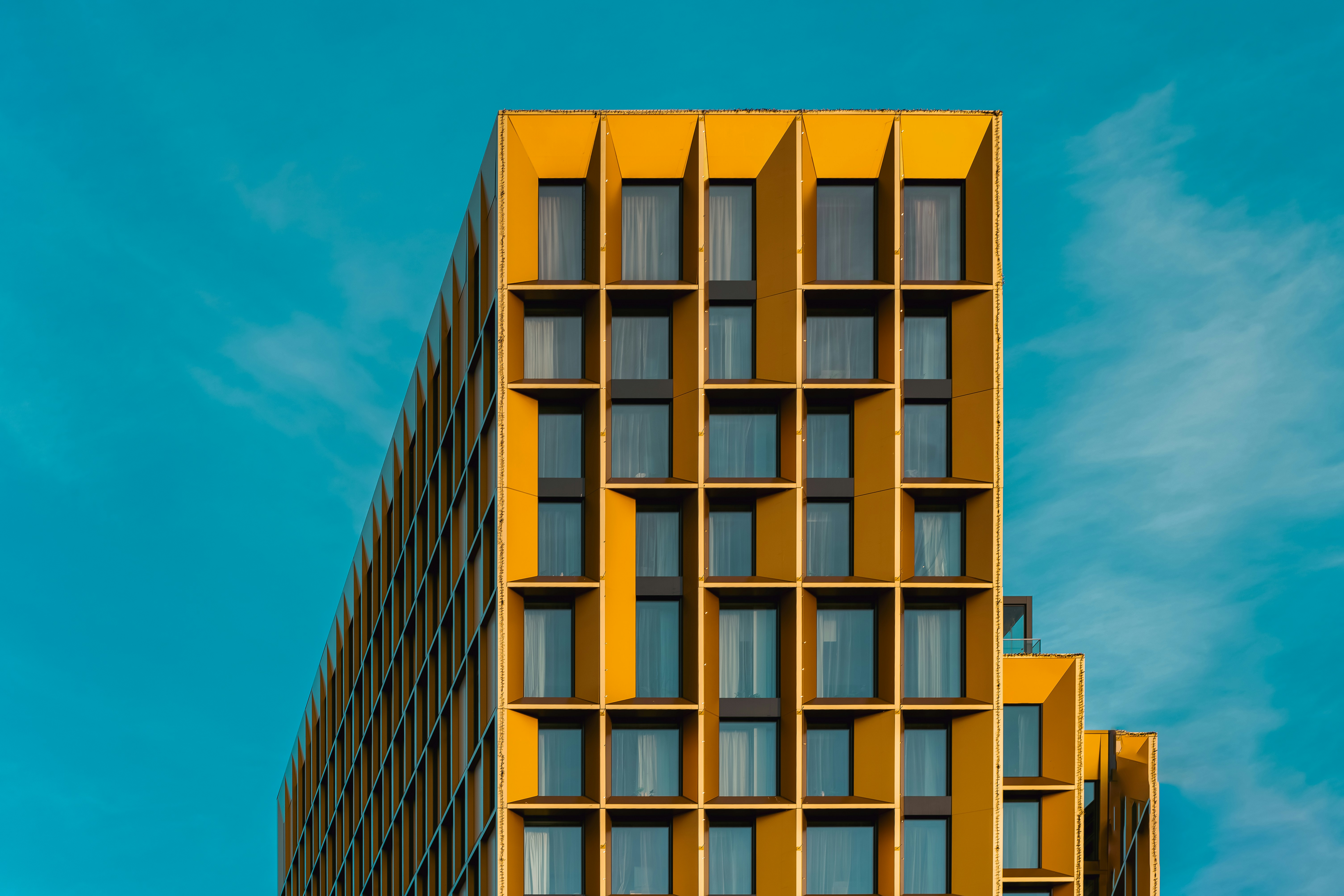 A tall yellow building with lots of windows photo – Free Oslo Image on ...
