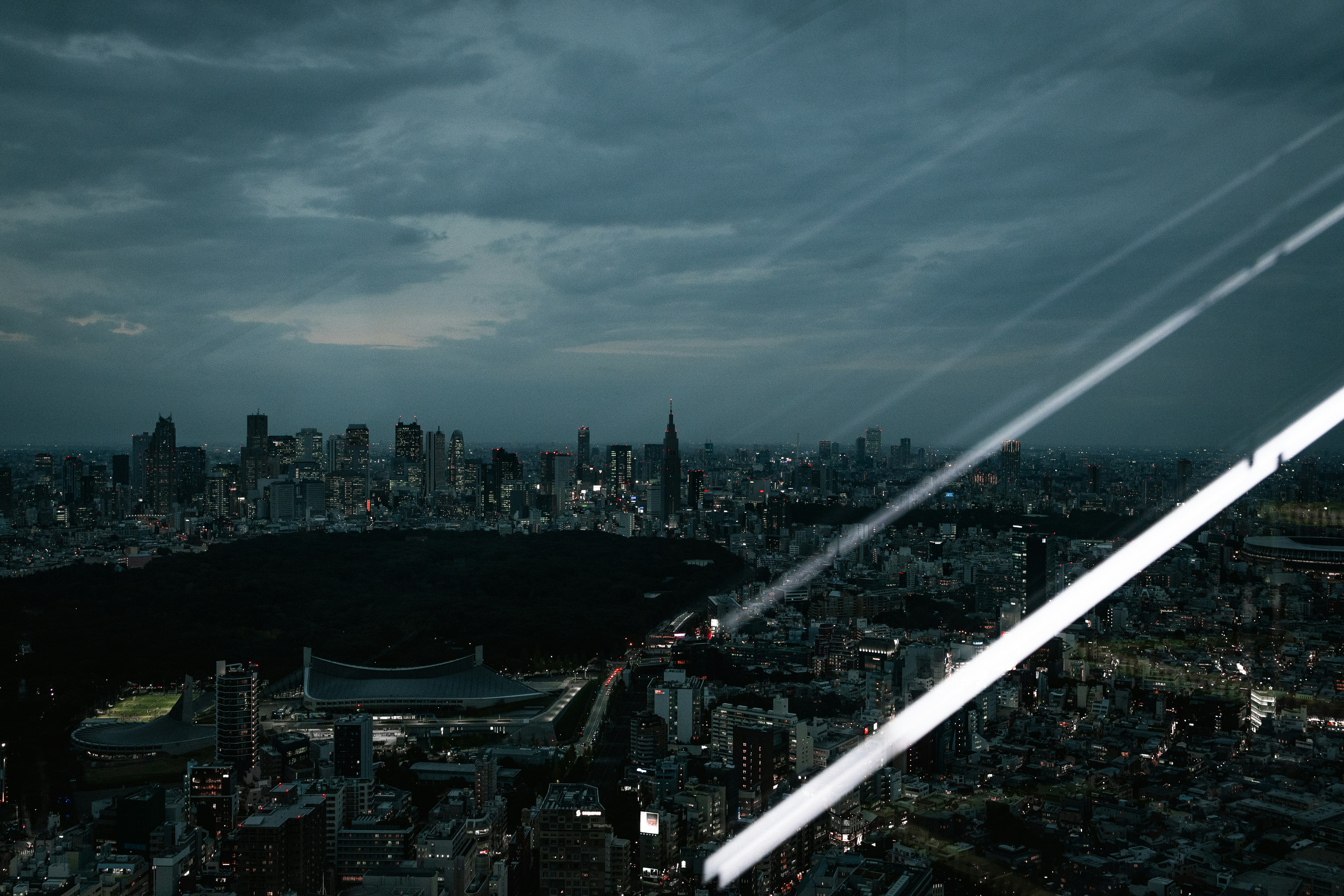 Twilight Skyline: Light Trails Carve Through a Cityscape