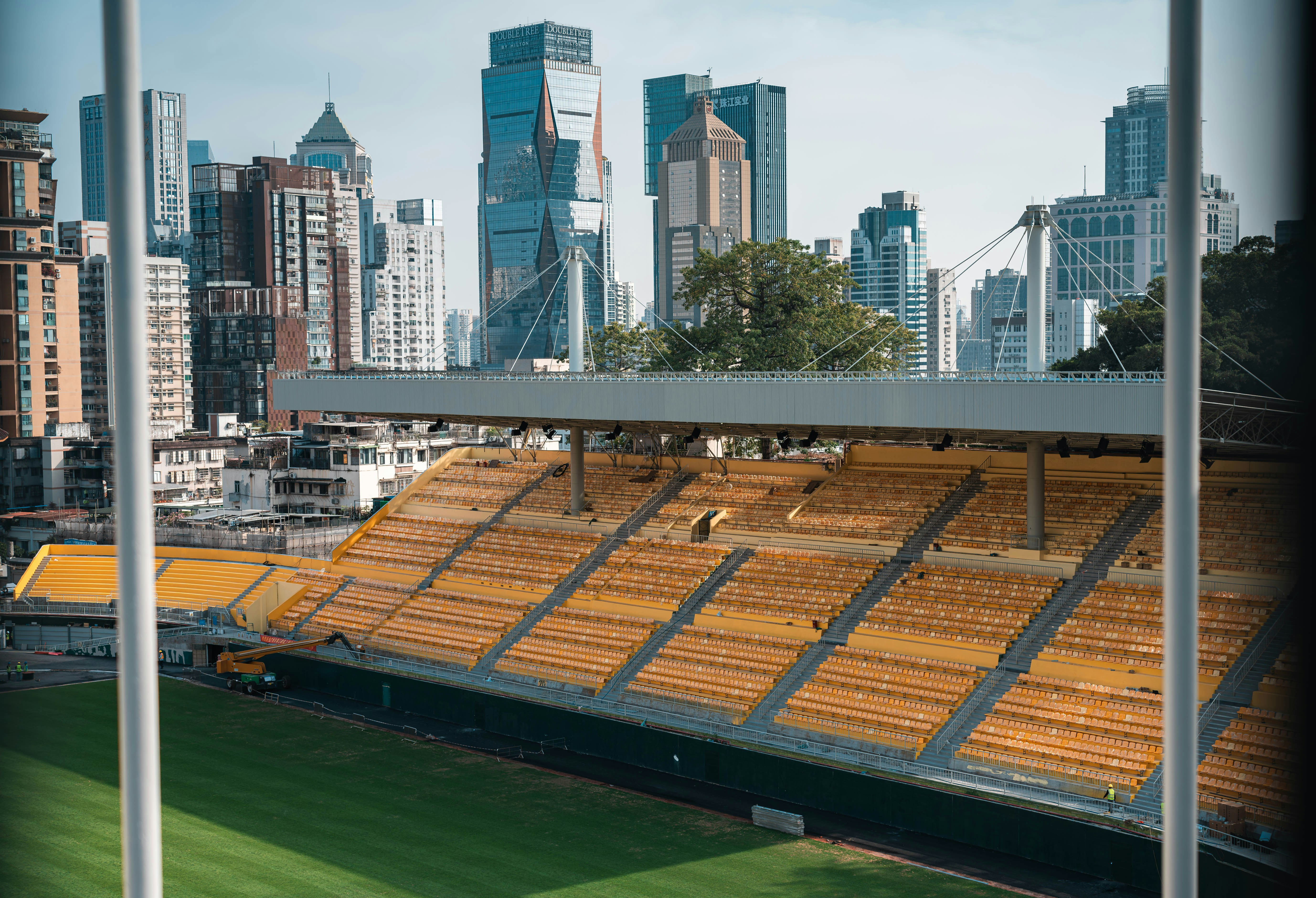 A stadium with a view of the city in the background