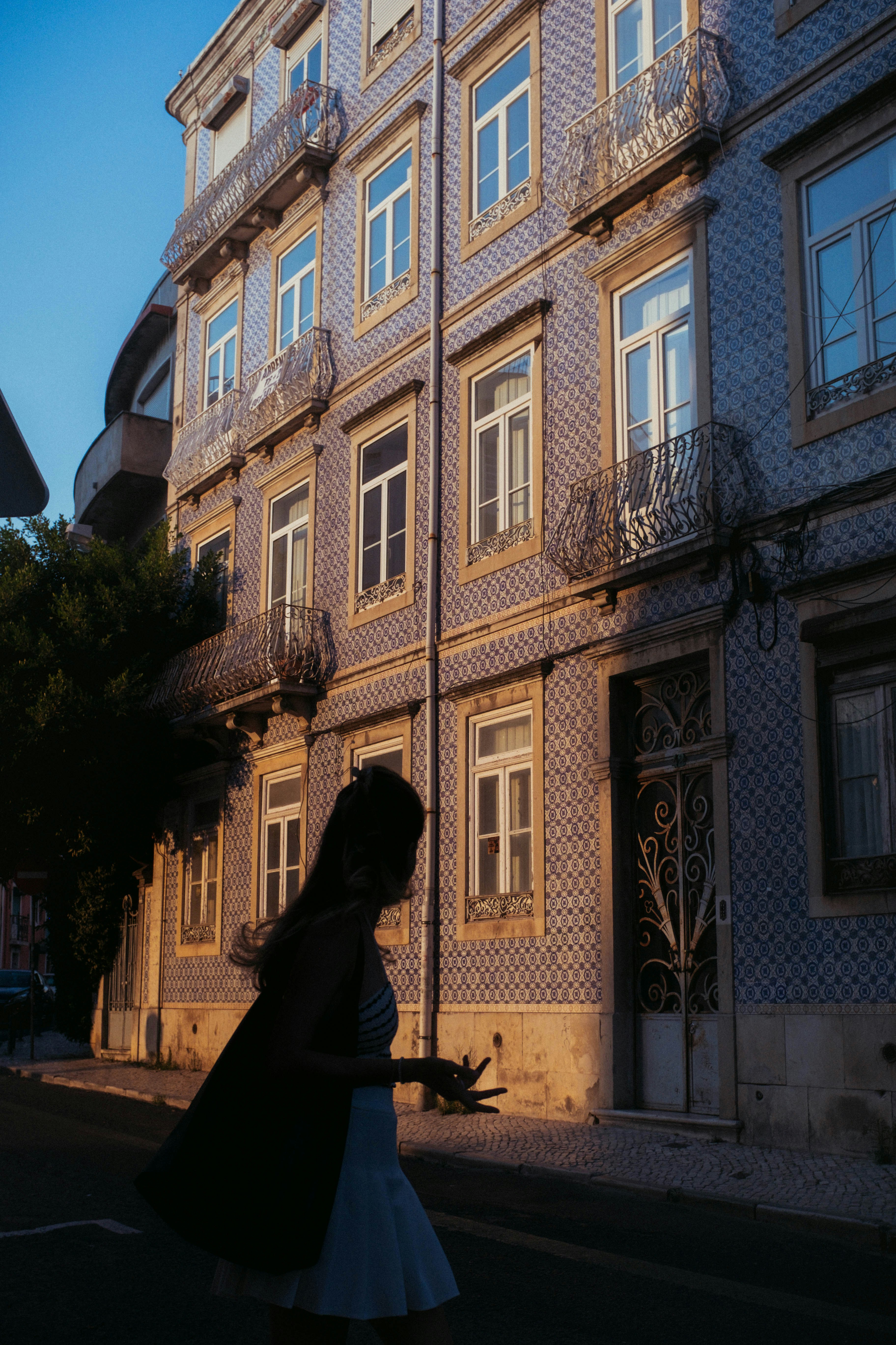 Dusk on the Azulejo Street: Silhouette at the Blue-Tiled FacadeIvan Mani