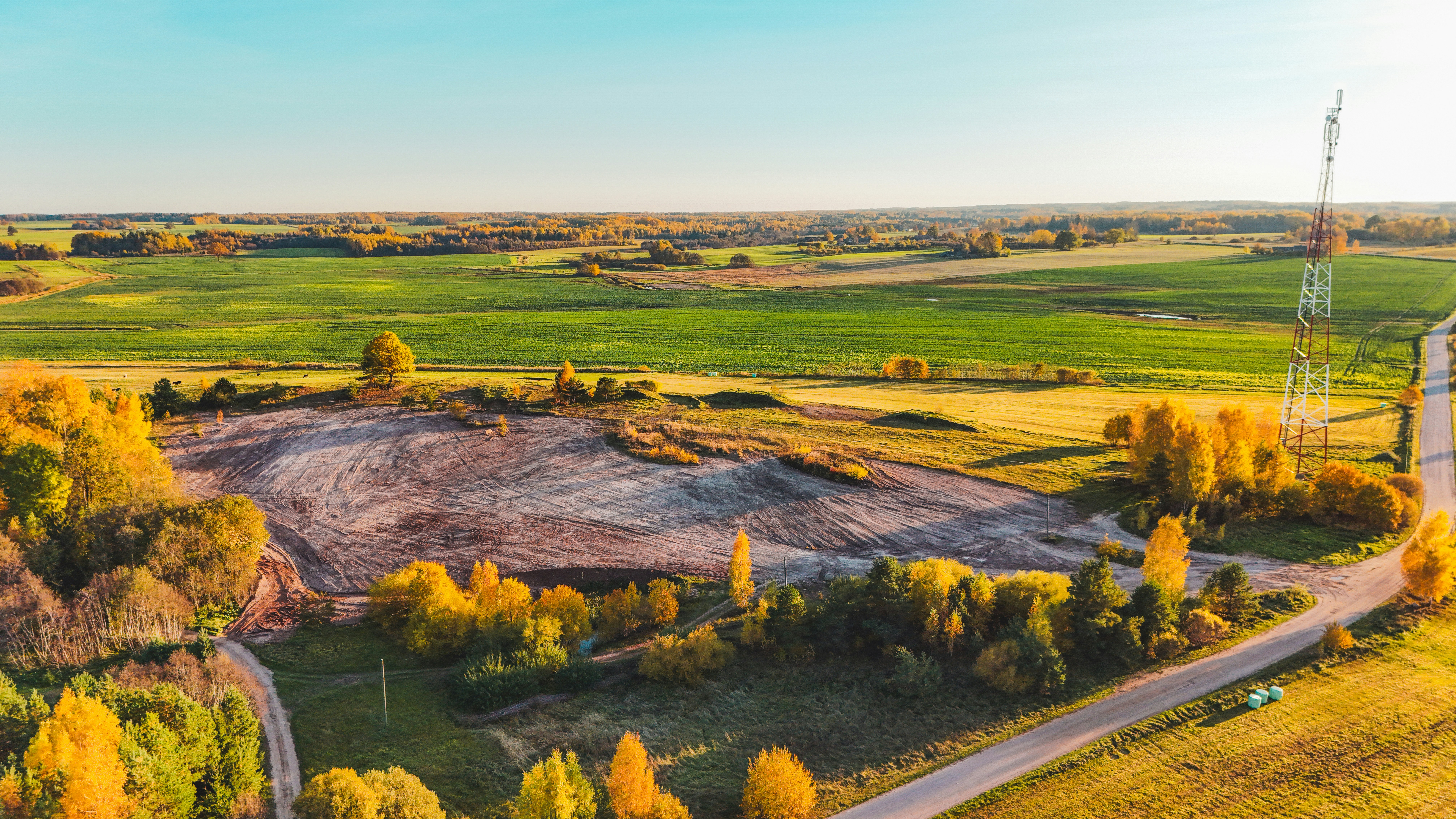 An aerial view of a farm and a road photo – Free Latvia Image on Unsplash