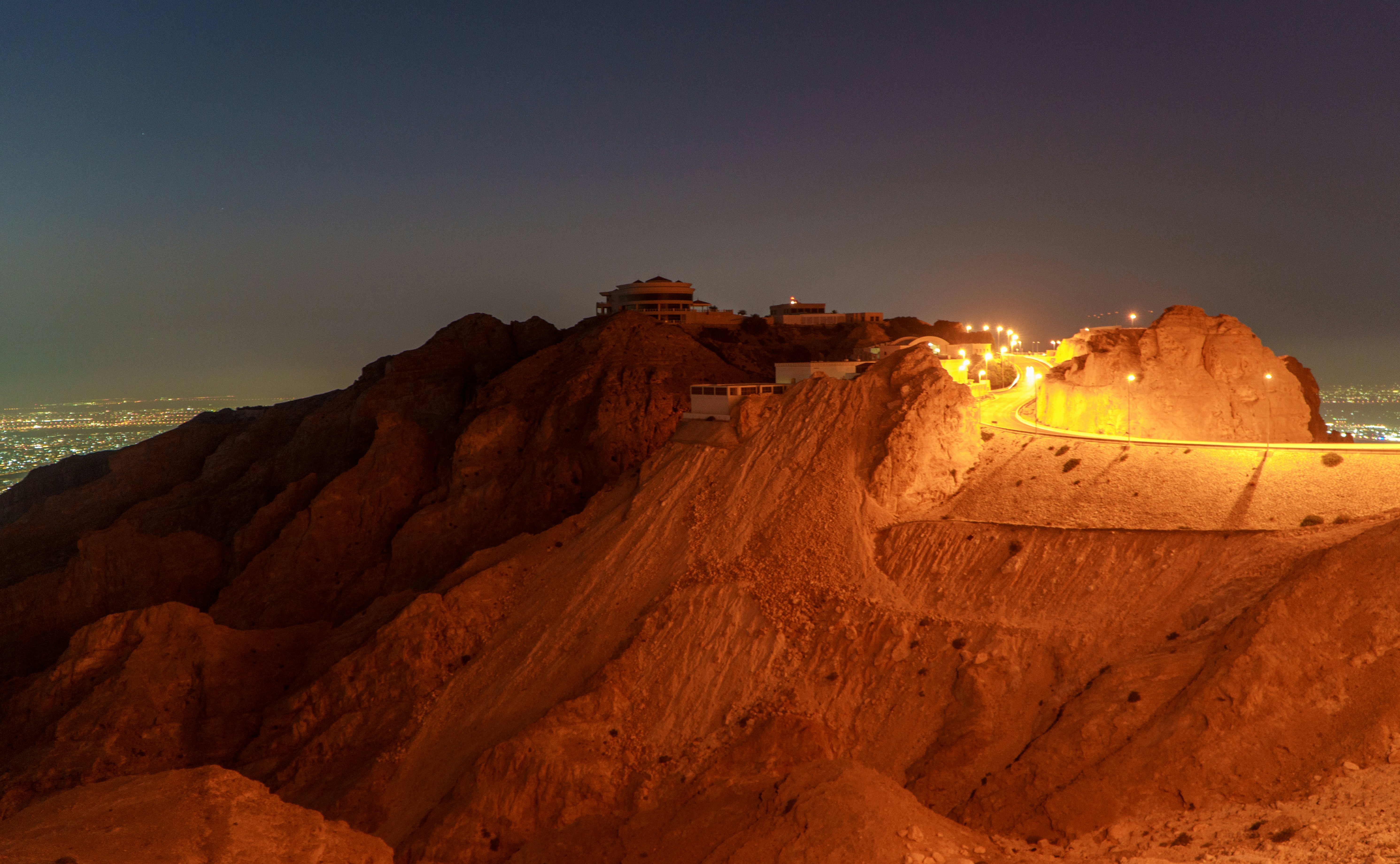 Nightfall at the Cliff Fort: Lanterned Ridge Above the Coast