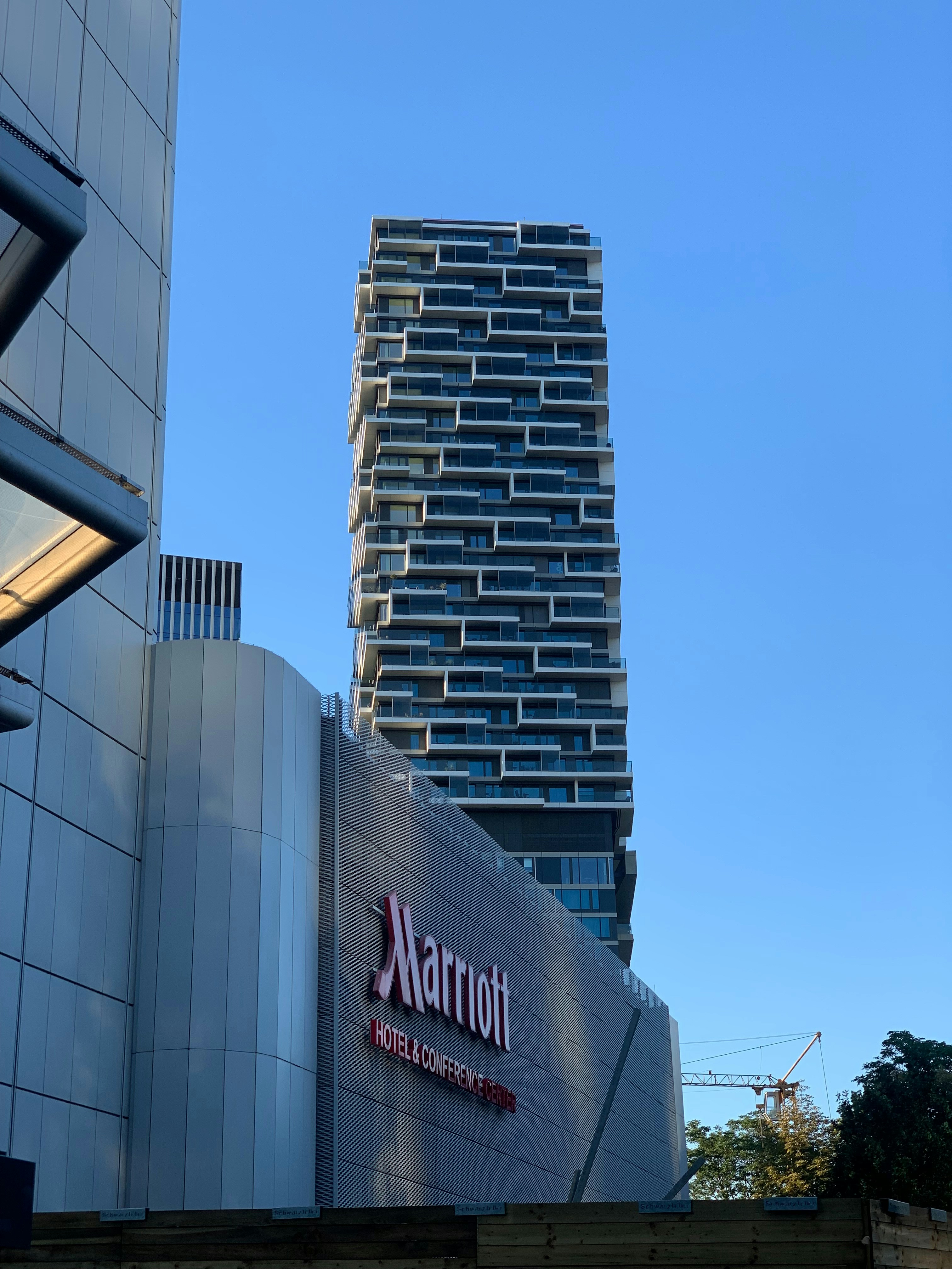 Stacked-Balcony Skyscraper Rising Above Marriott’s Modern Facade