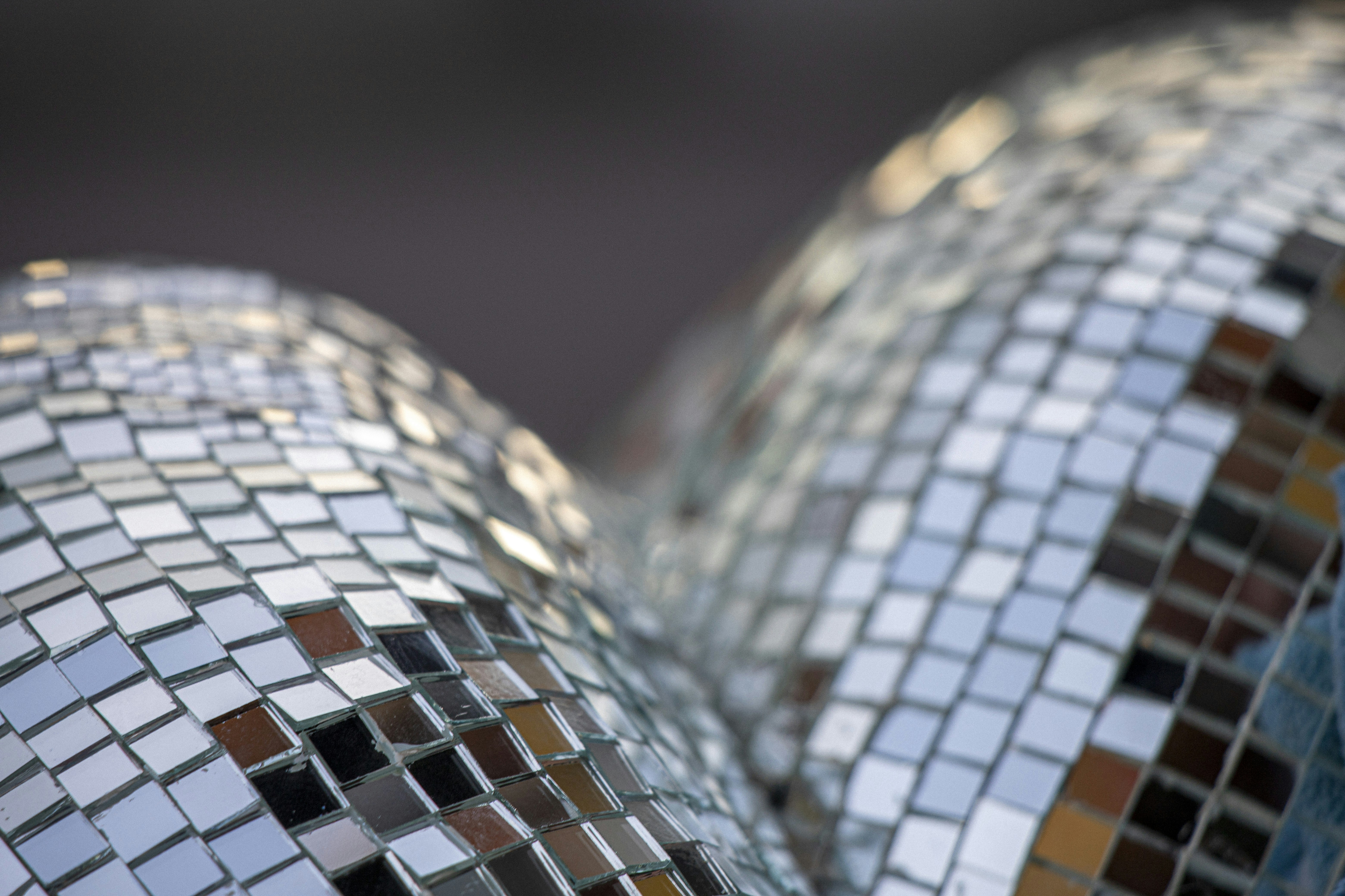 A close up of a mirror ball on a table photo – Free Sculpture Image on ...
