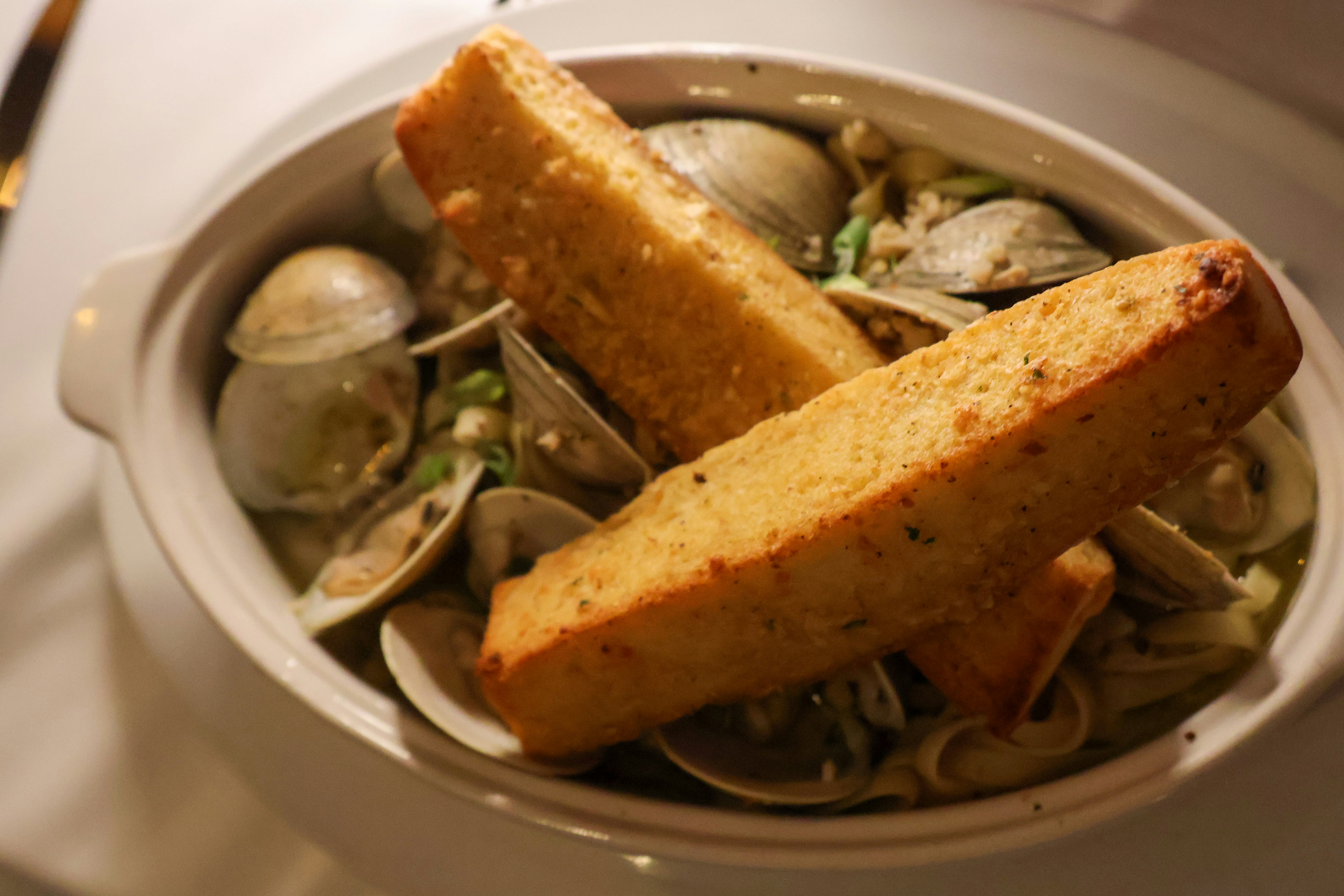 Crouton Crown Over a Clam-Broth Ensemble