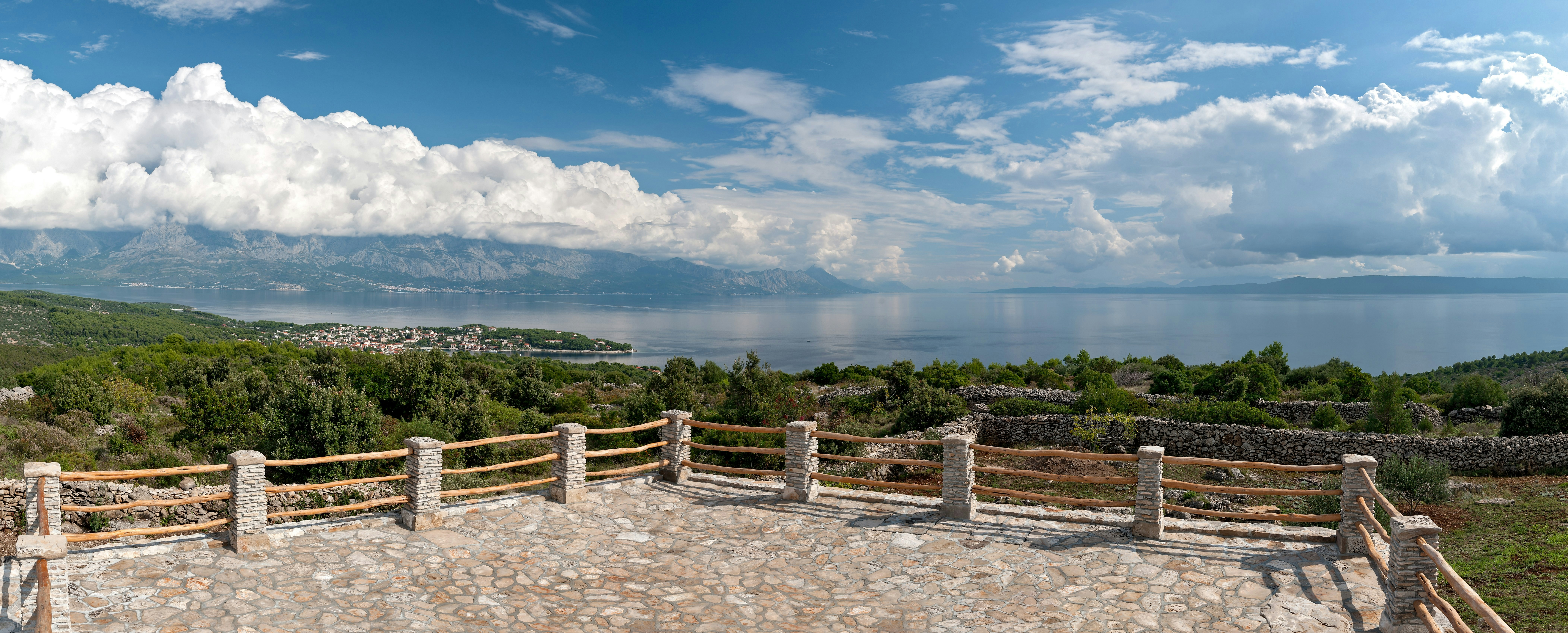Horizon Framed by Stone Terrace: Coastal Panorama