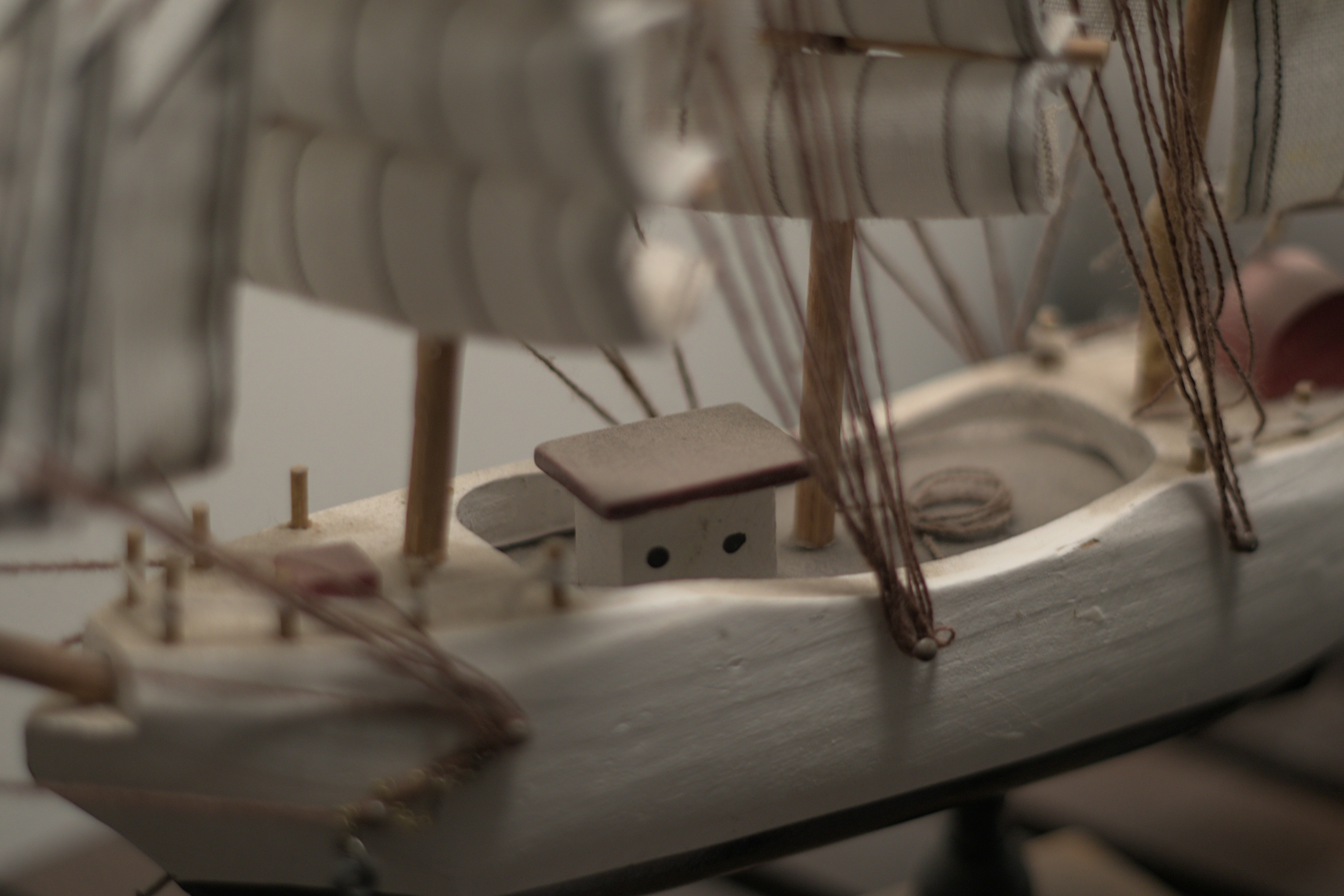 Tiny Deckhouse Amid Rigging: A Close-Up on a Wooden Model Schooner