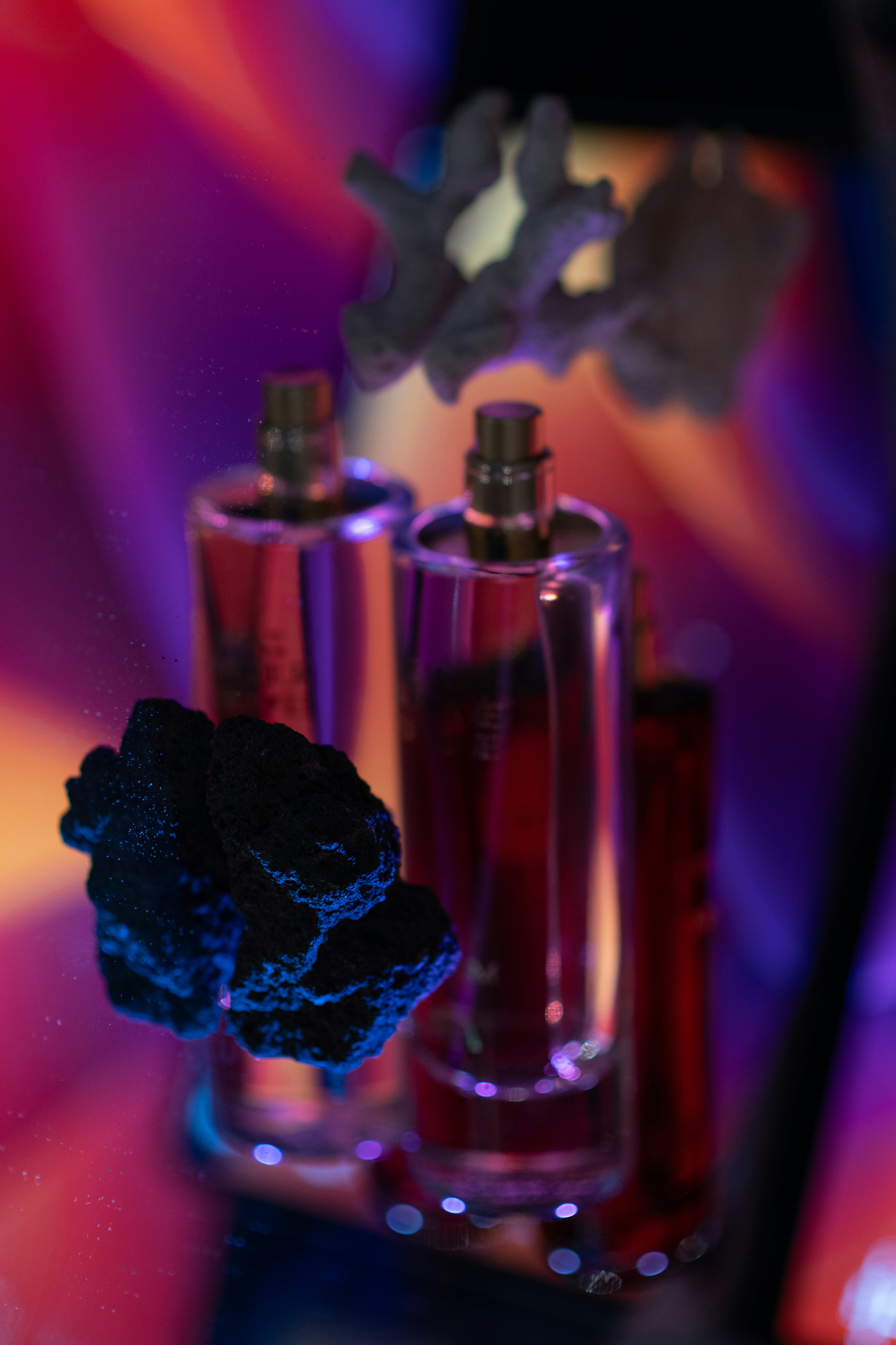 Vibrant Bottles and Coral Cloud: Neon Glow on a Velvet Night