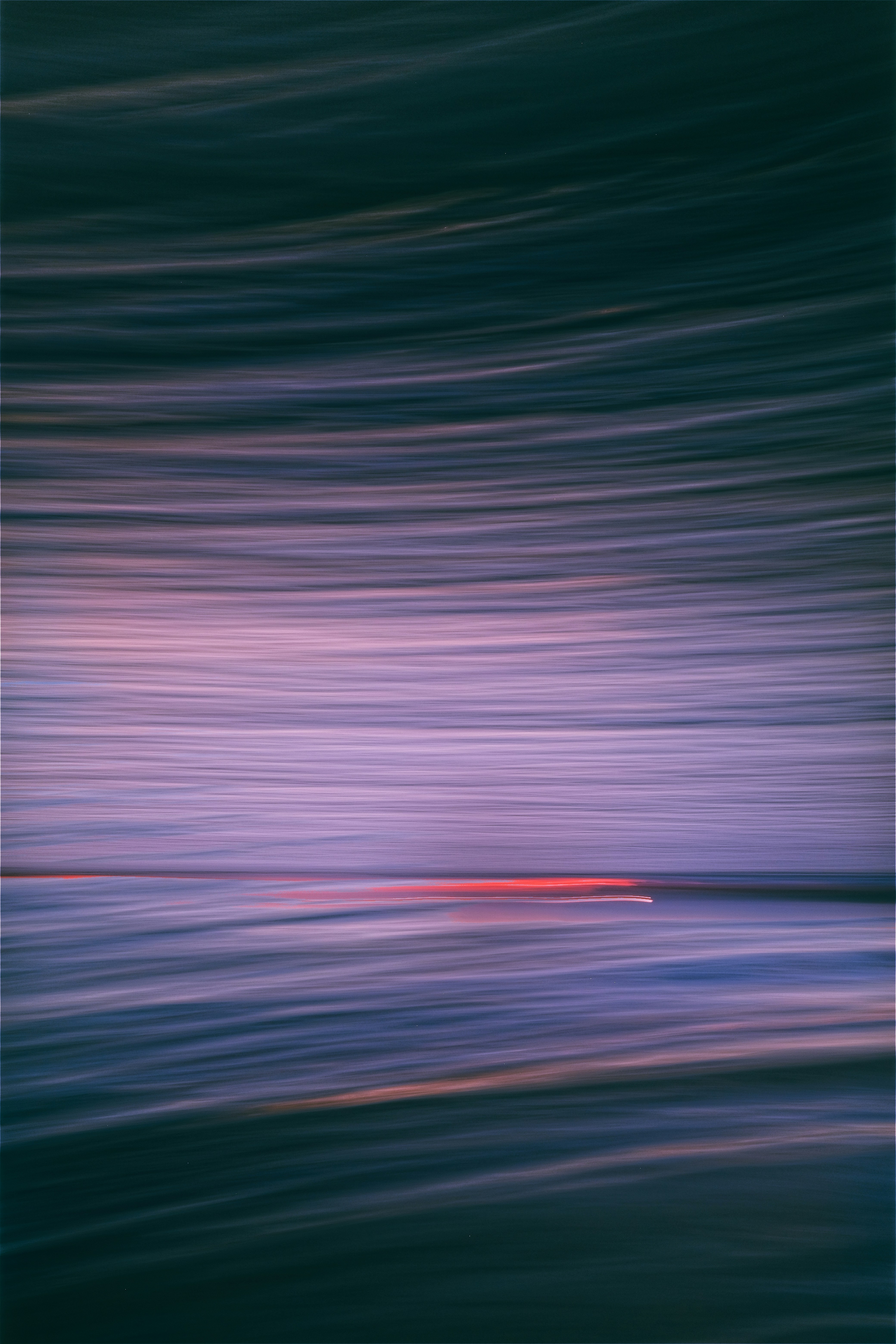 A blurry photo of the ocean at sunset photo – Free Experimental Image ...
