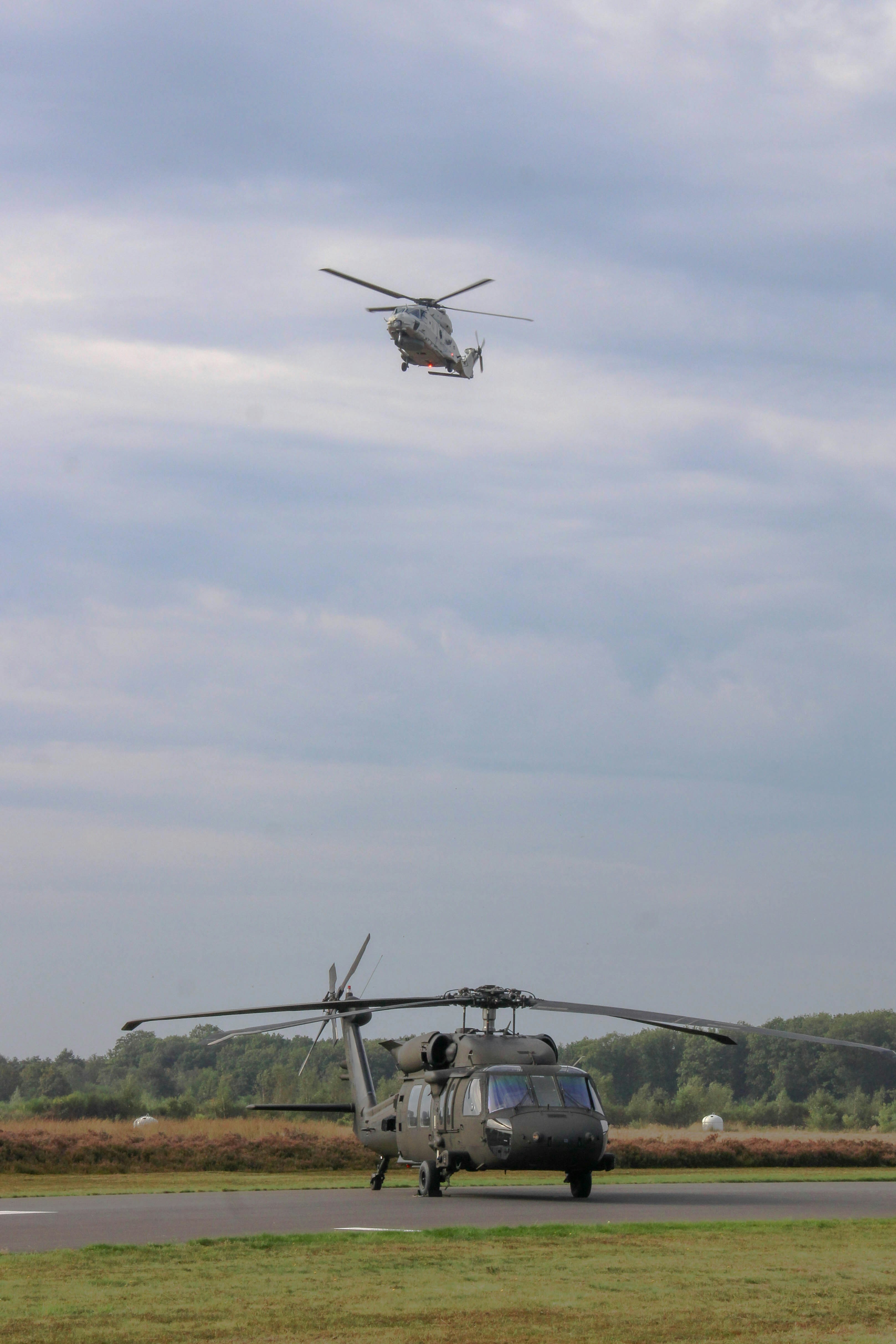 A helicopter that is sitting on a runway photo – Free Belgium Image on ...