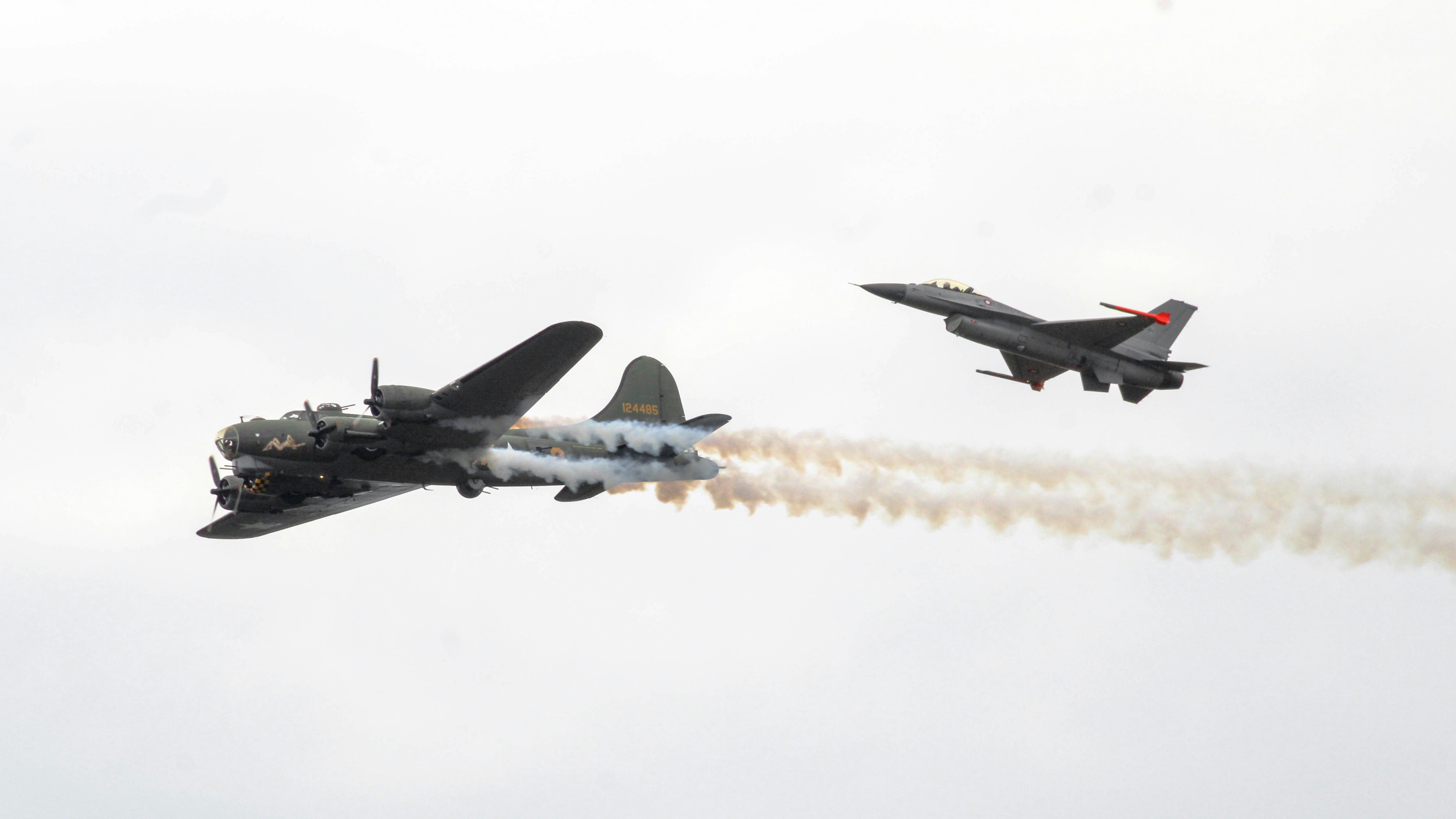 A couple of airplanes flying through the sky photo – Free Military ...