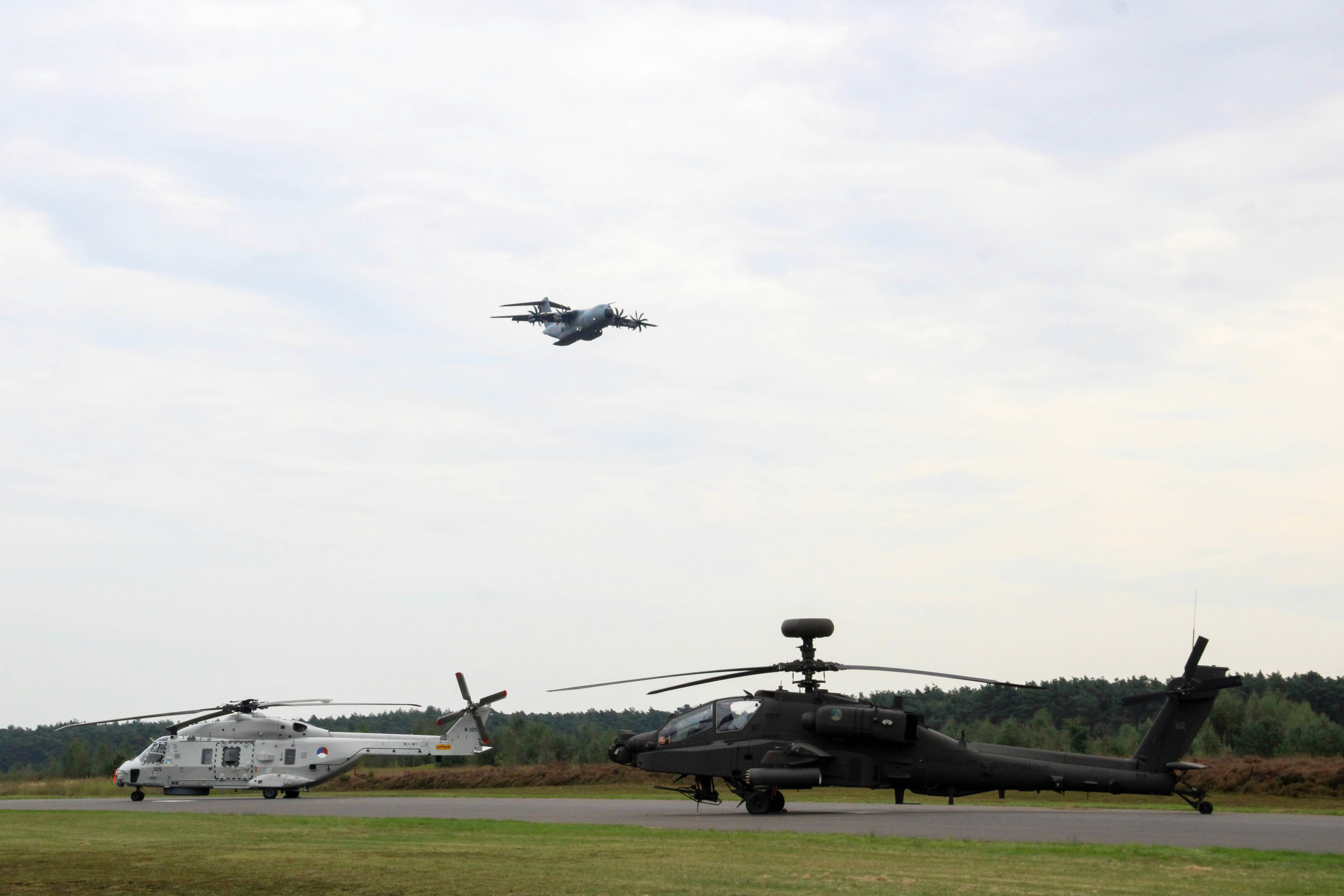 A helicopter and a helicopter on a runway photo – Free Airplane Image ...