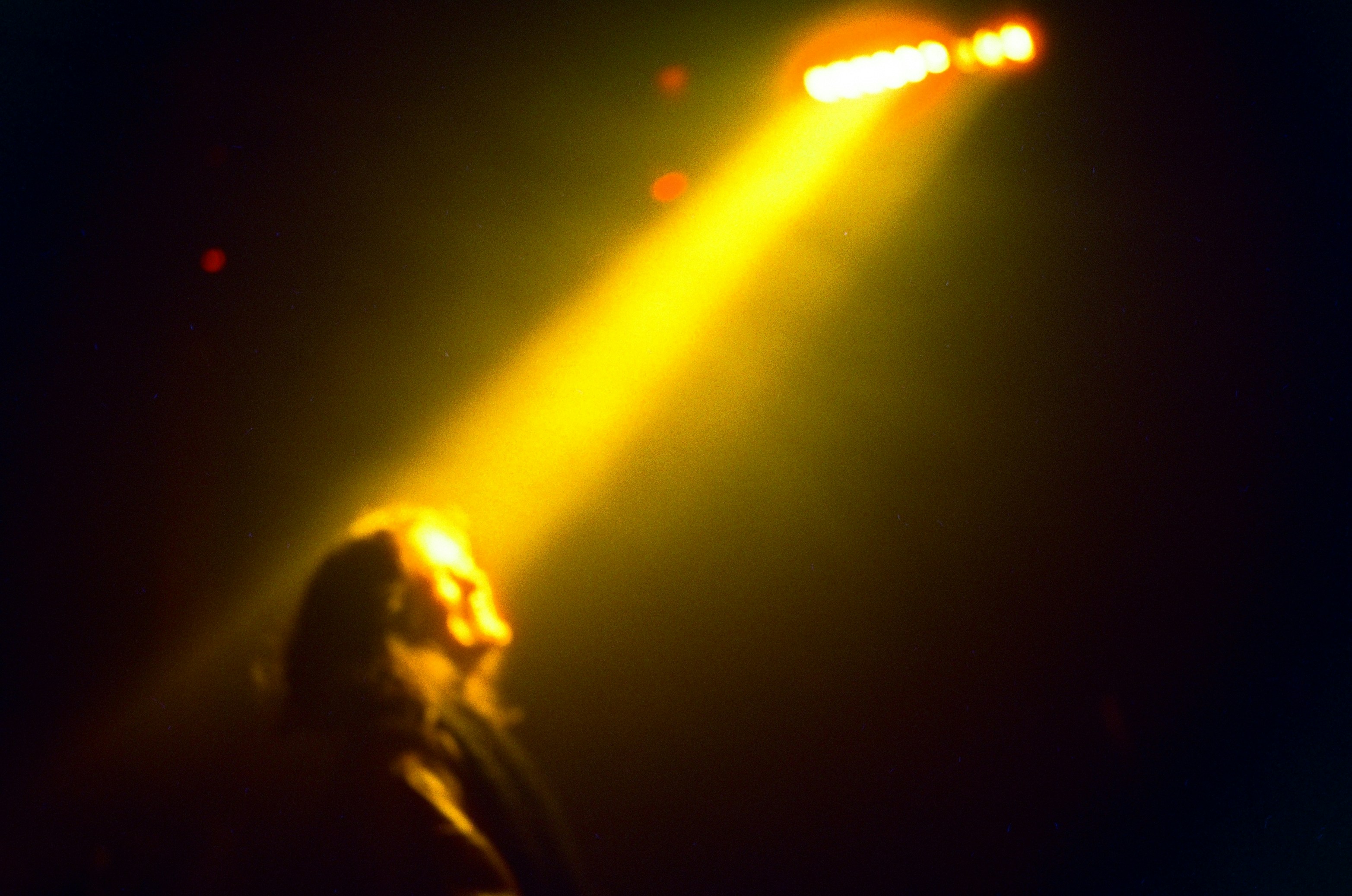 A man standing in front of a yellow light photo – Free Kyiv Image on ...