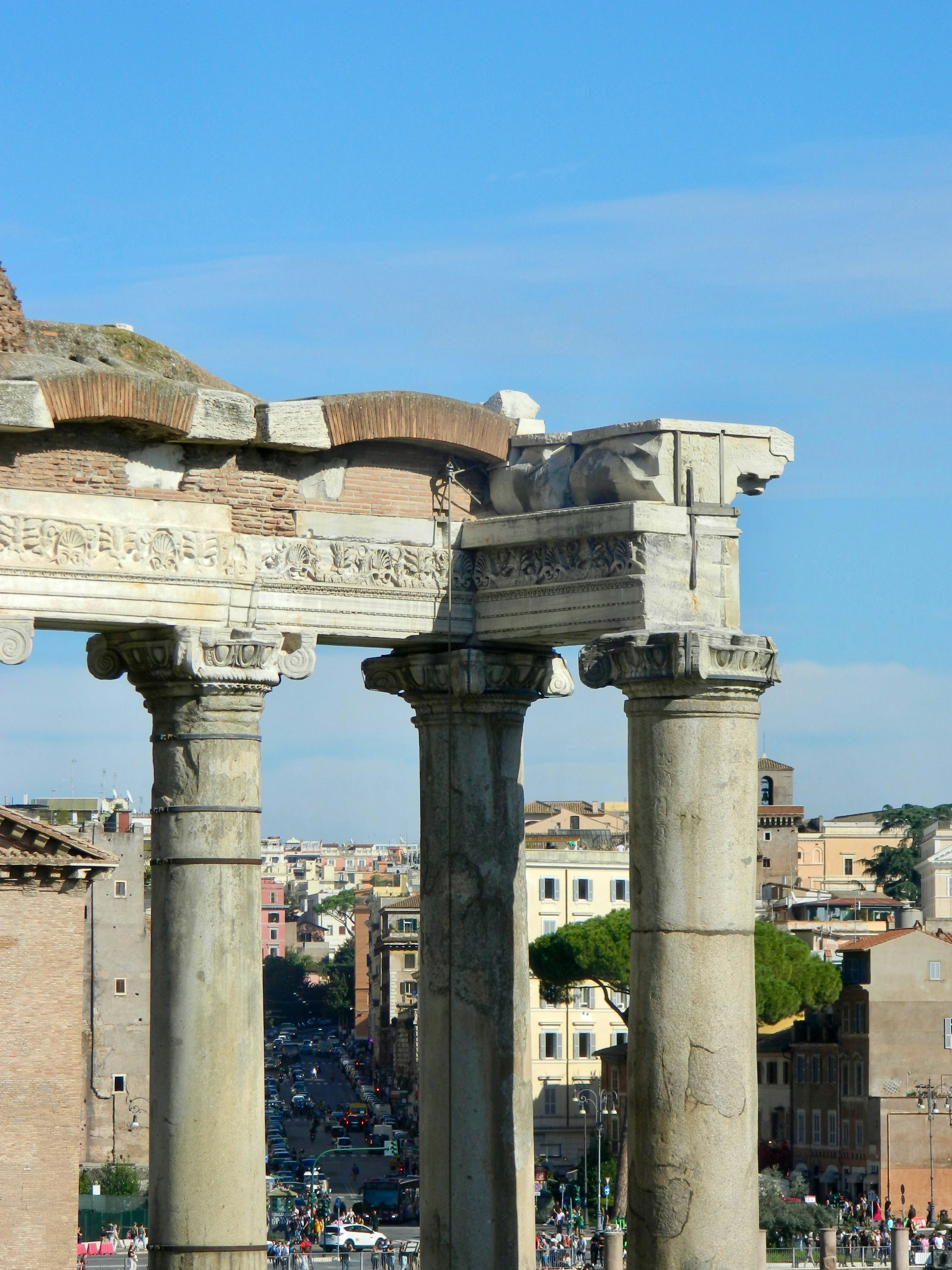 Time-Stamped Ruins: Columns Framing a Lively Roman Street
