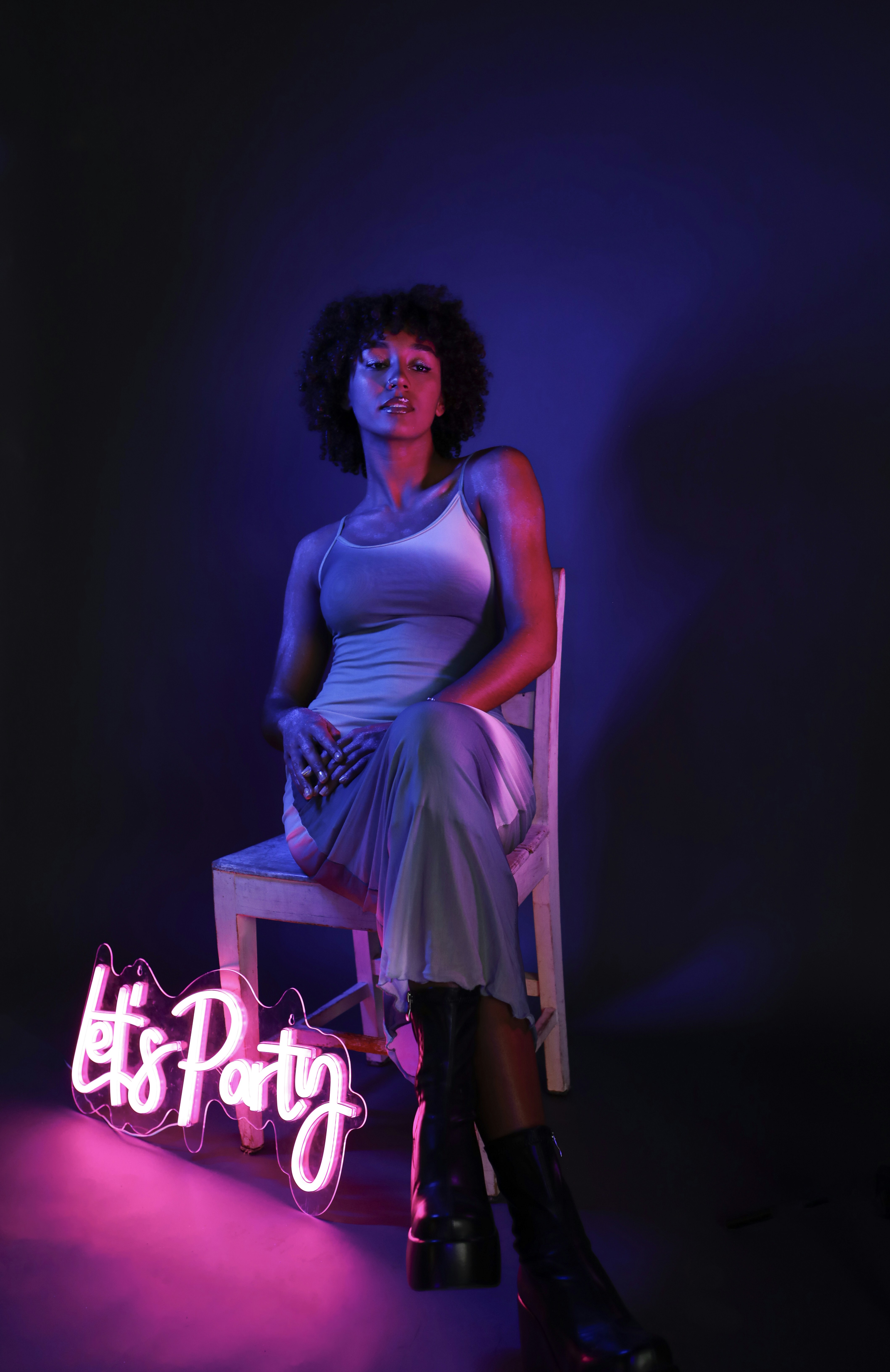 Neon Velvet: A Night Portrait Beneath Purple Neon Glow