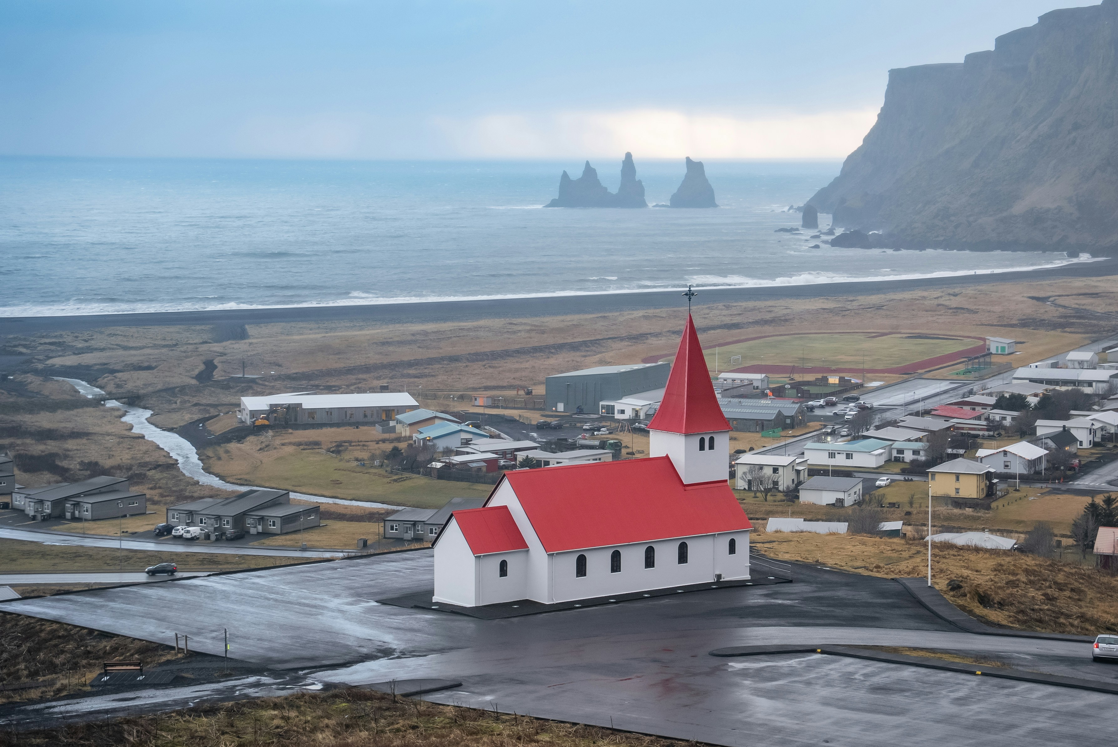 A small white church with a red roof