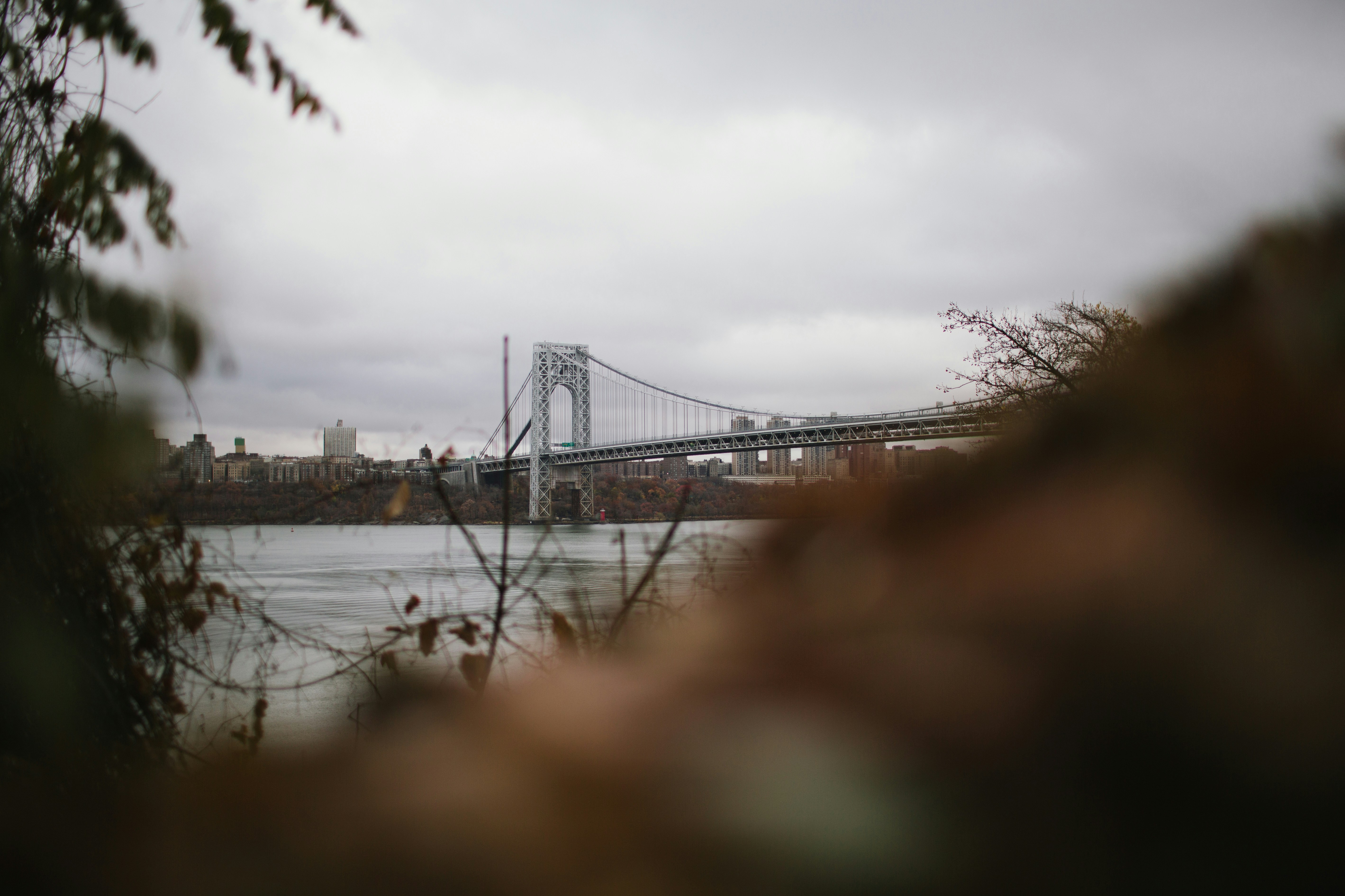 A blurry photo of a bridge over a body of water photo – Free New york ...
