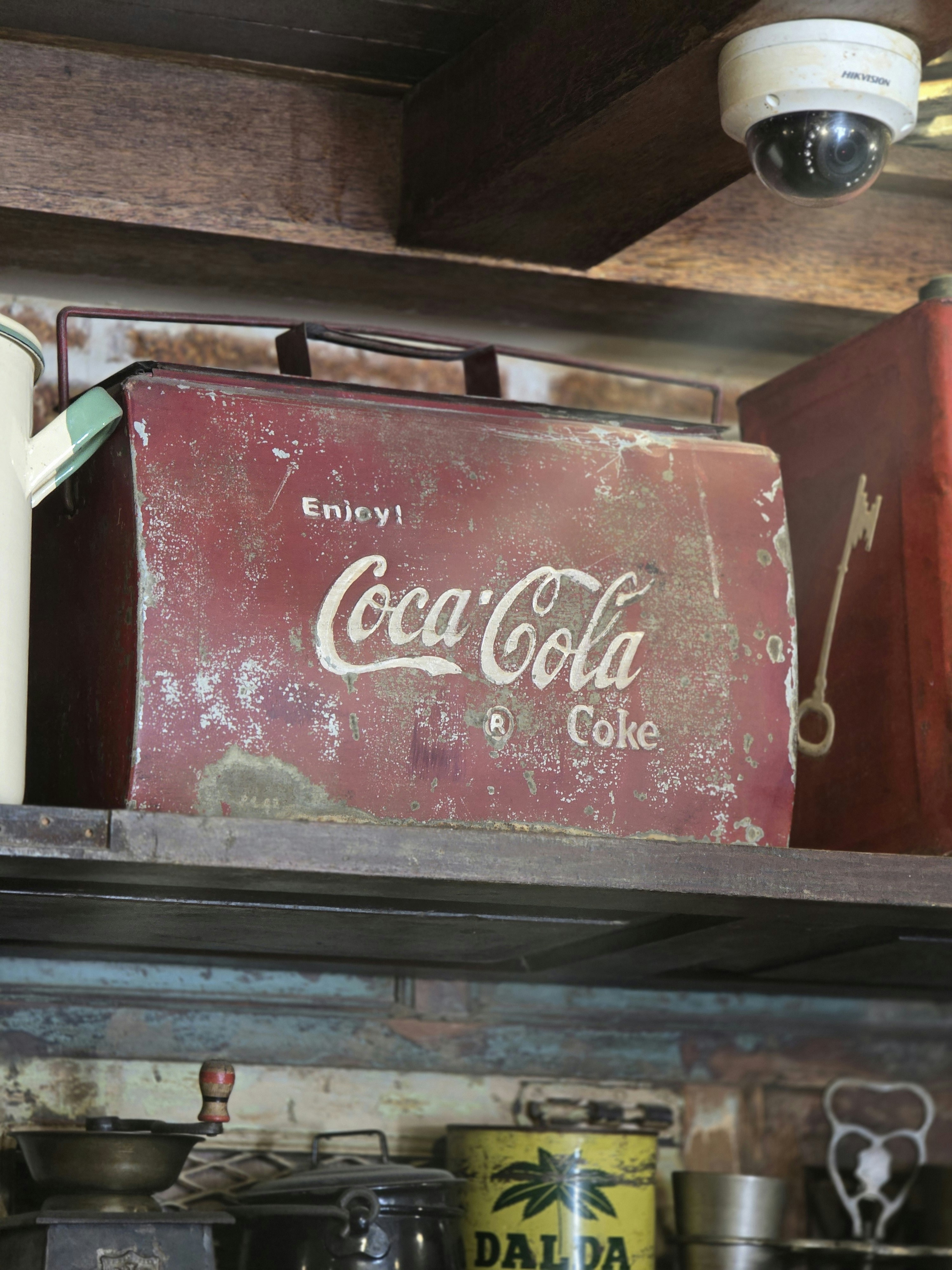 An old coca cola box is sitting on a shelf photo – Free Drink Image on ...