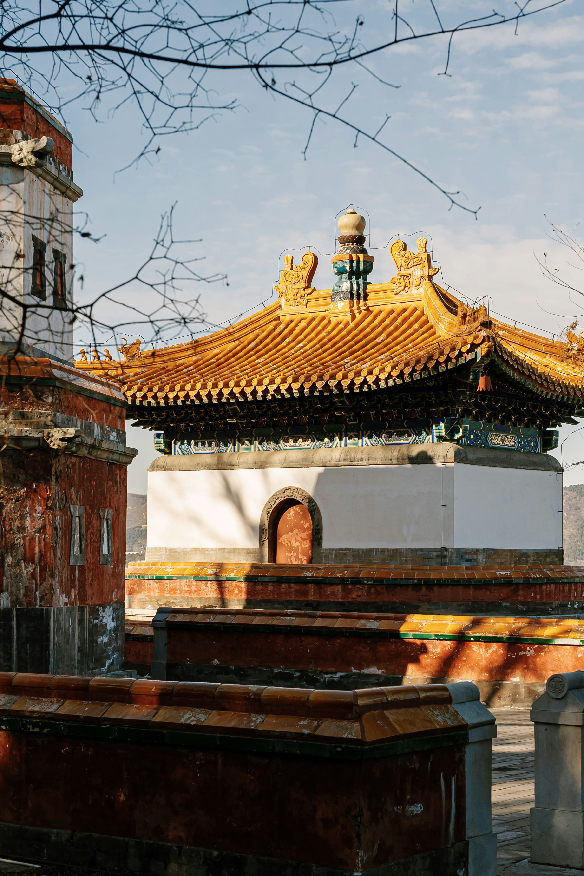Sunlit Golden Roof Crowned Chinese Temple Above a Layered Courtyard