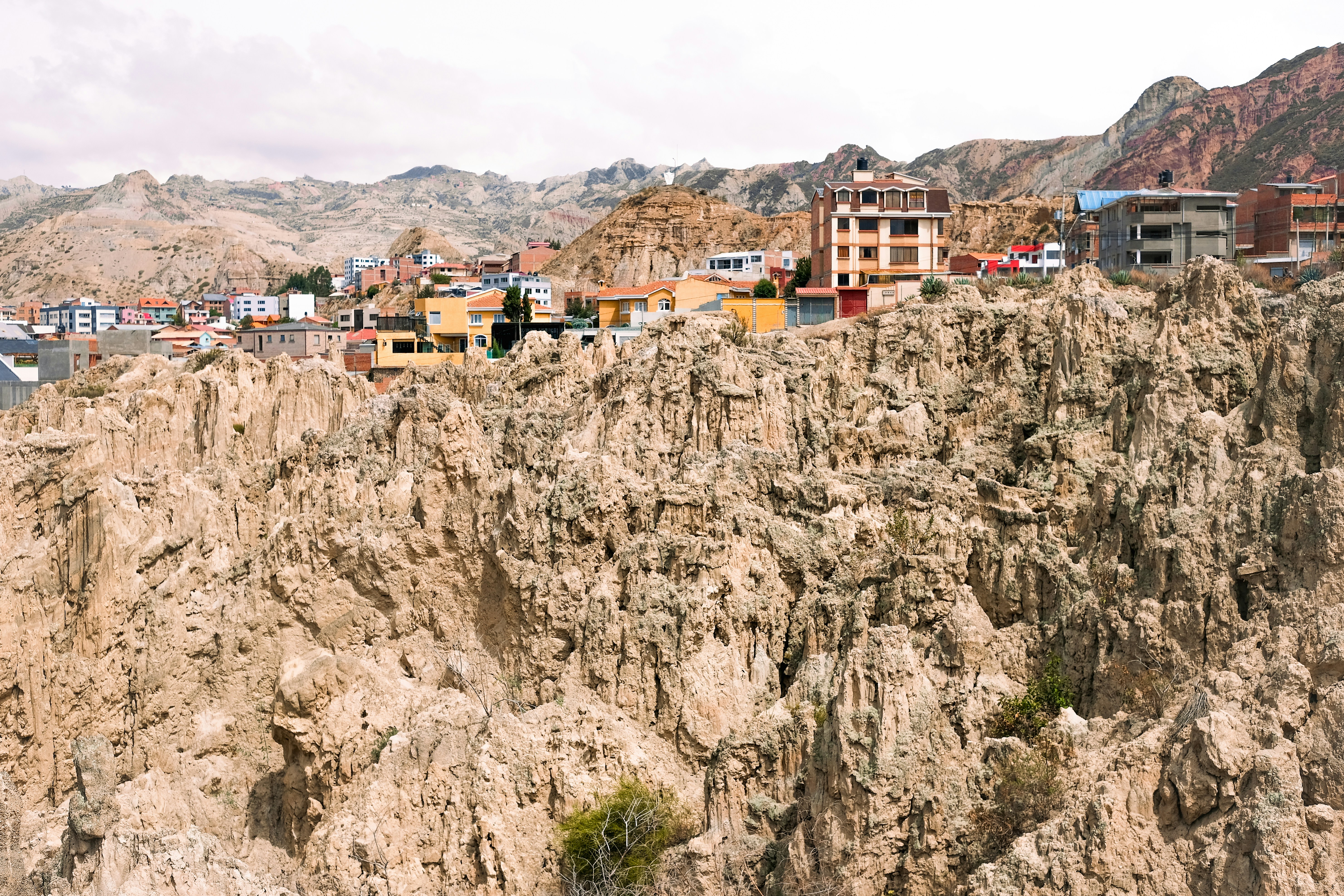 Clifftop Mosaic: Colorful Homes Perched on a Harsh Ridge