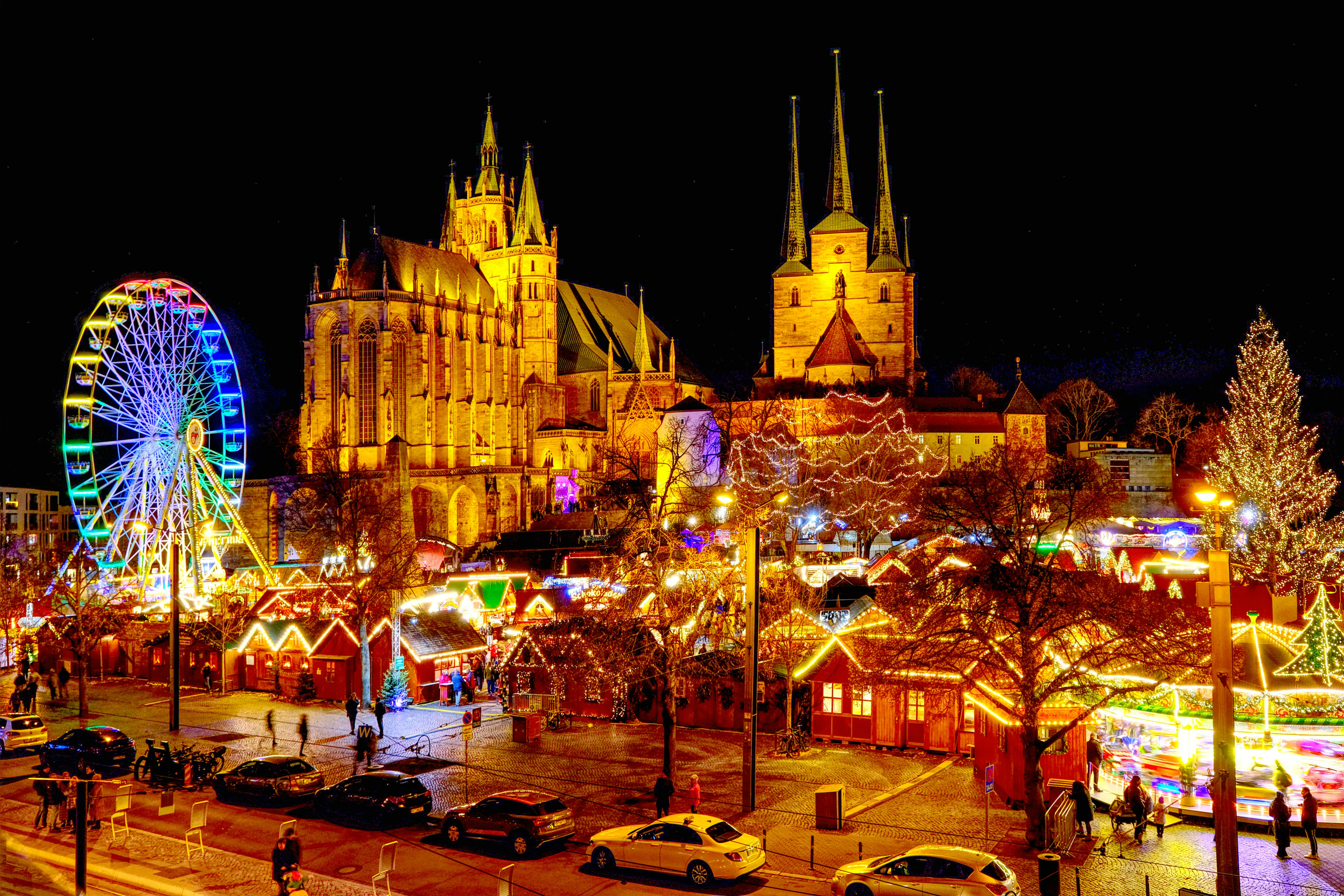 Vibrant Winter Fair Beneath Illuminated Cathedral