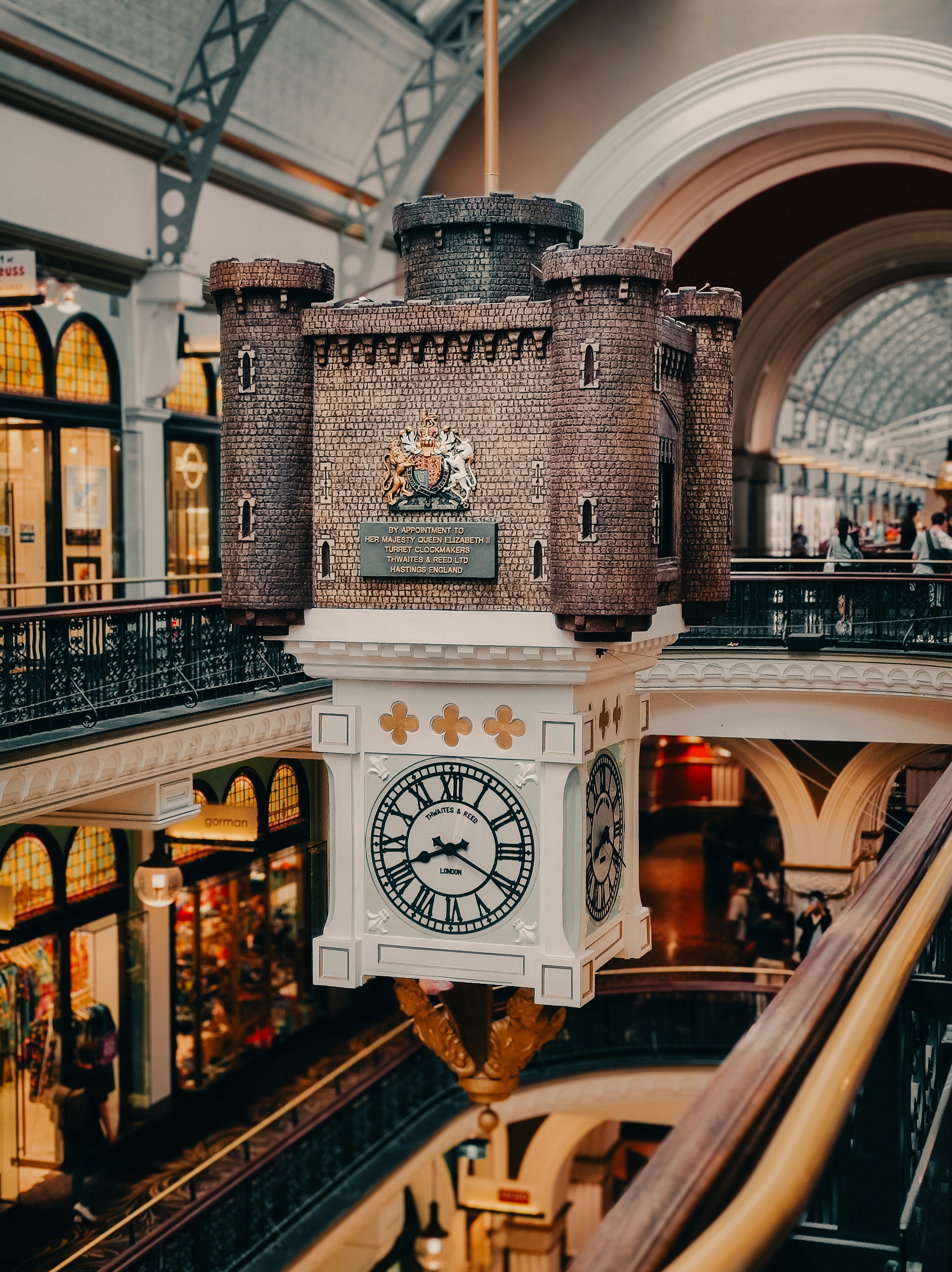 A clock tower in the middle of a shopping mall photo – Free Building ...