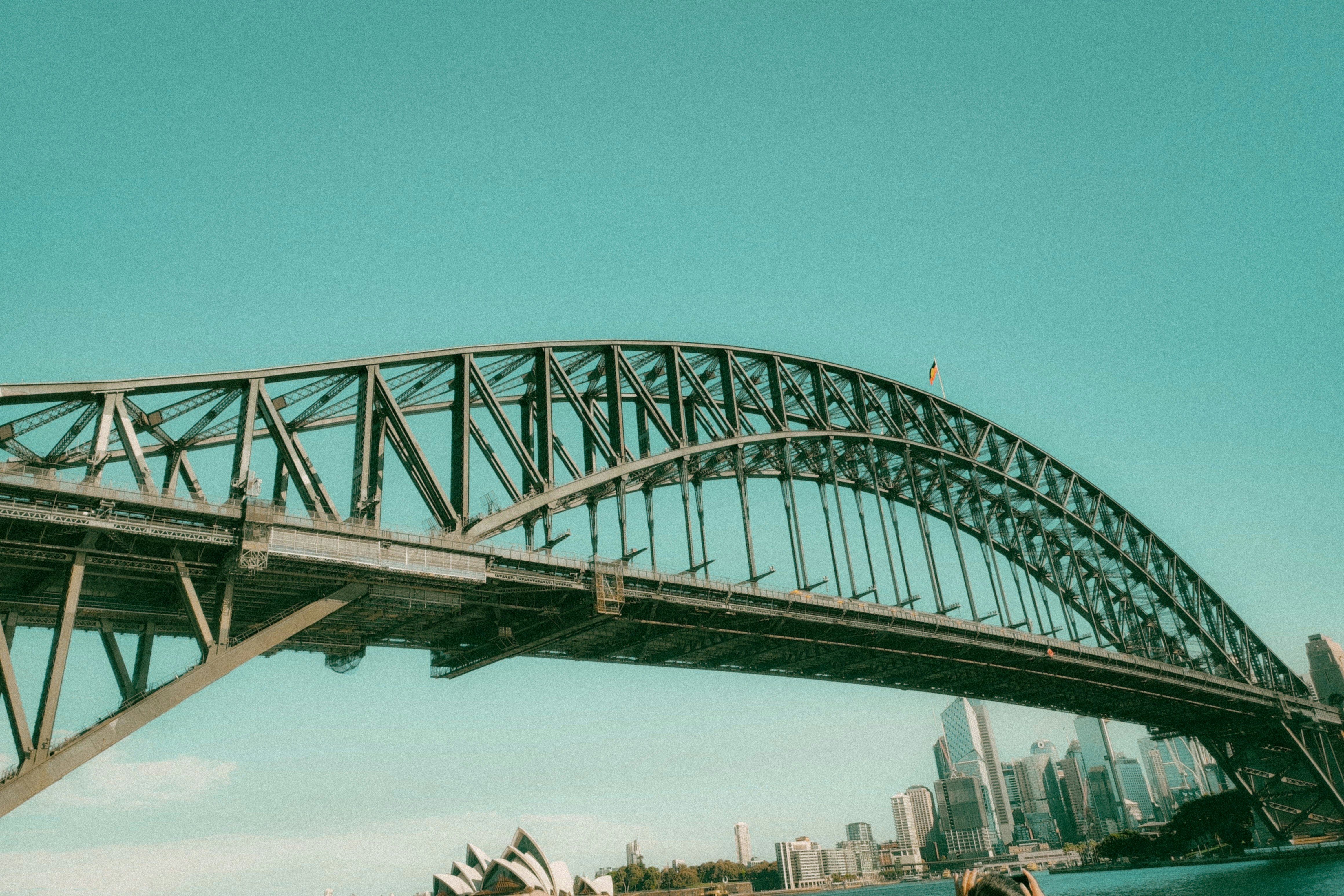 A large bridge spanning over a body of water photo – Free Building ...