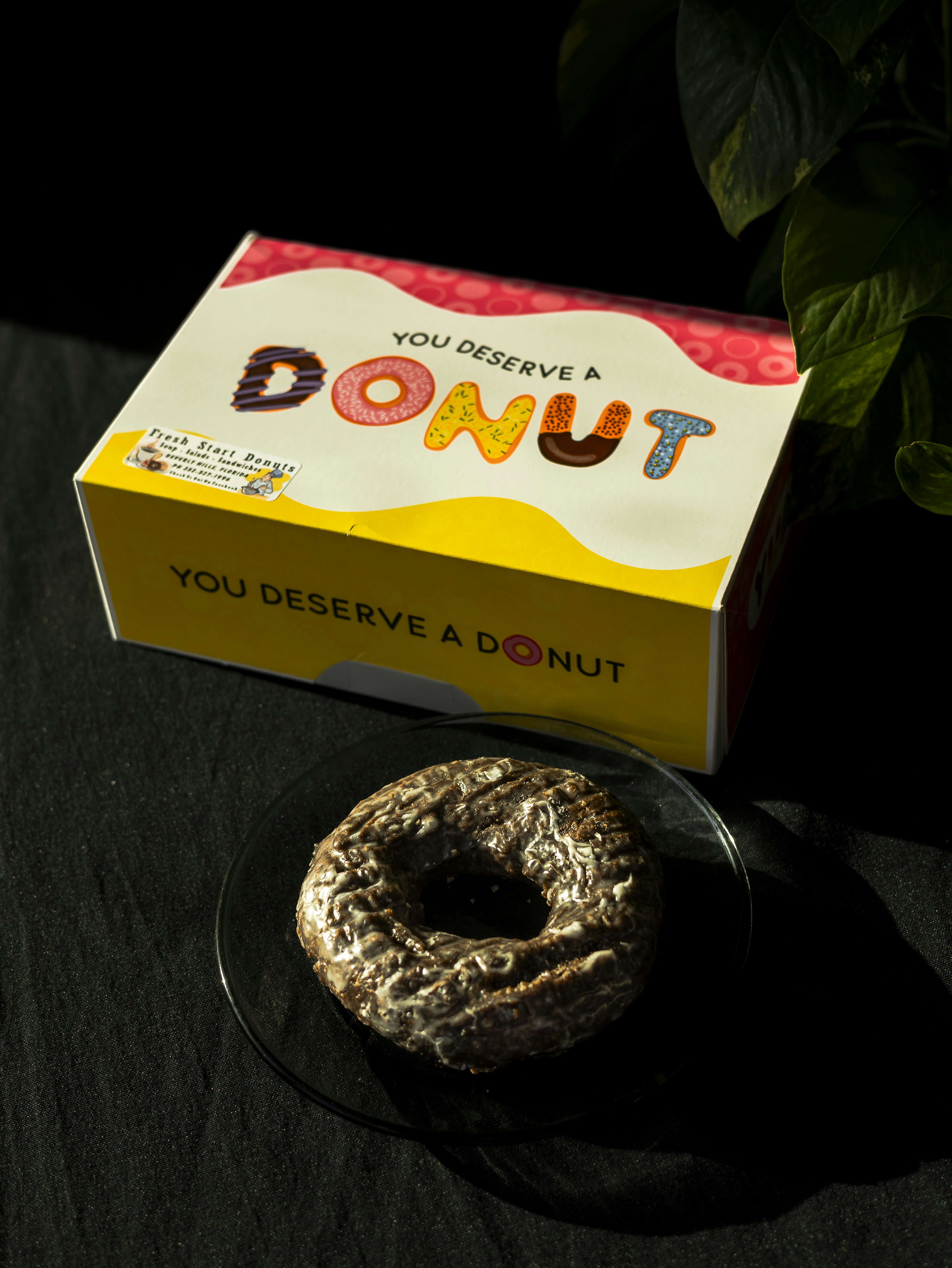 Nutty Morning: A Donut Box Poised Above a Glazed Ring