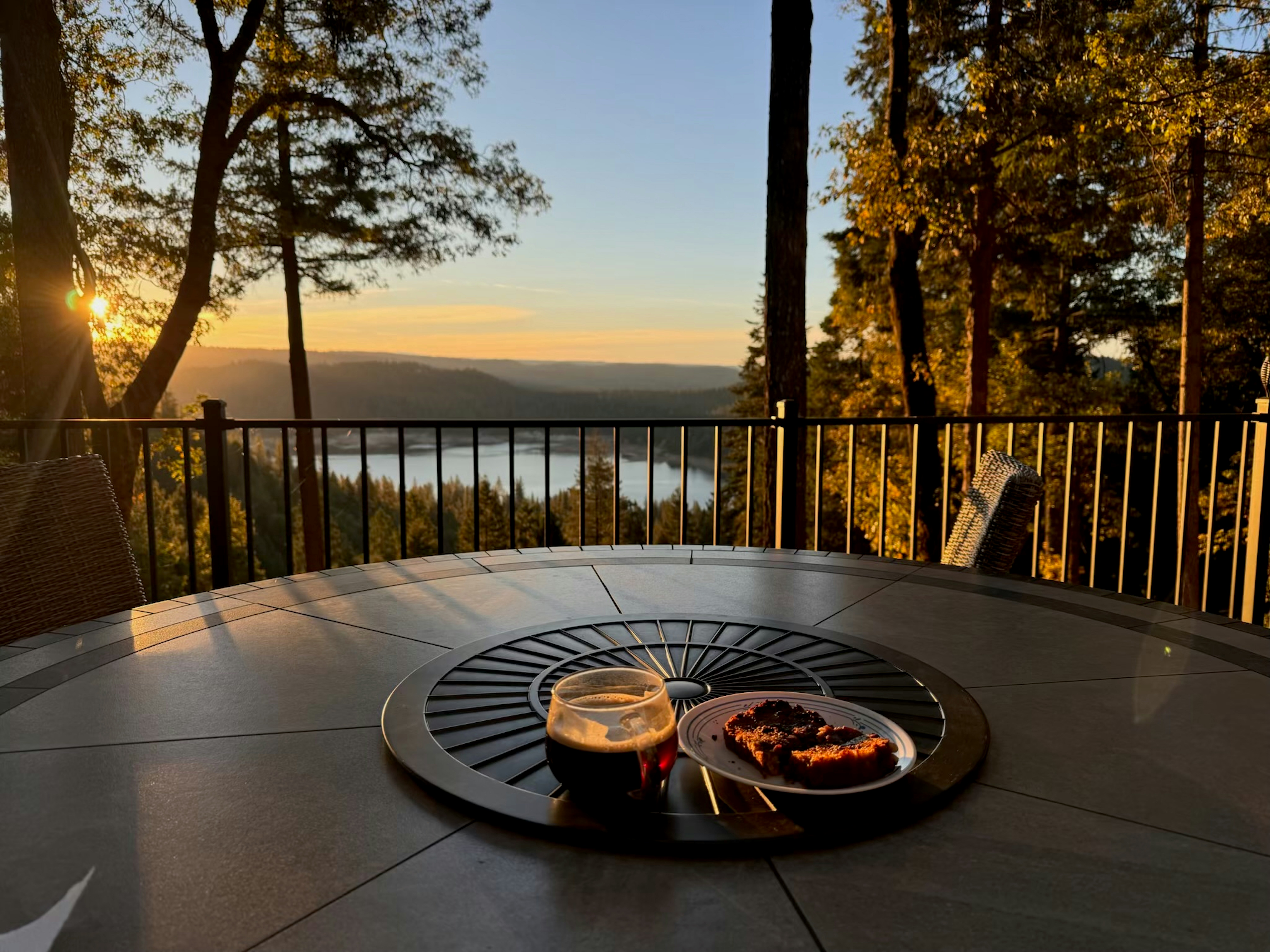 Dusk Terrace Ritual: Dessert, Drink, and a Circular Grill Framing the Valley