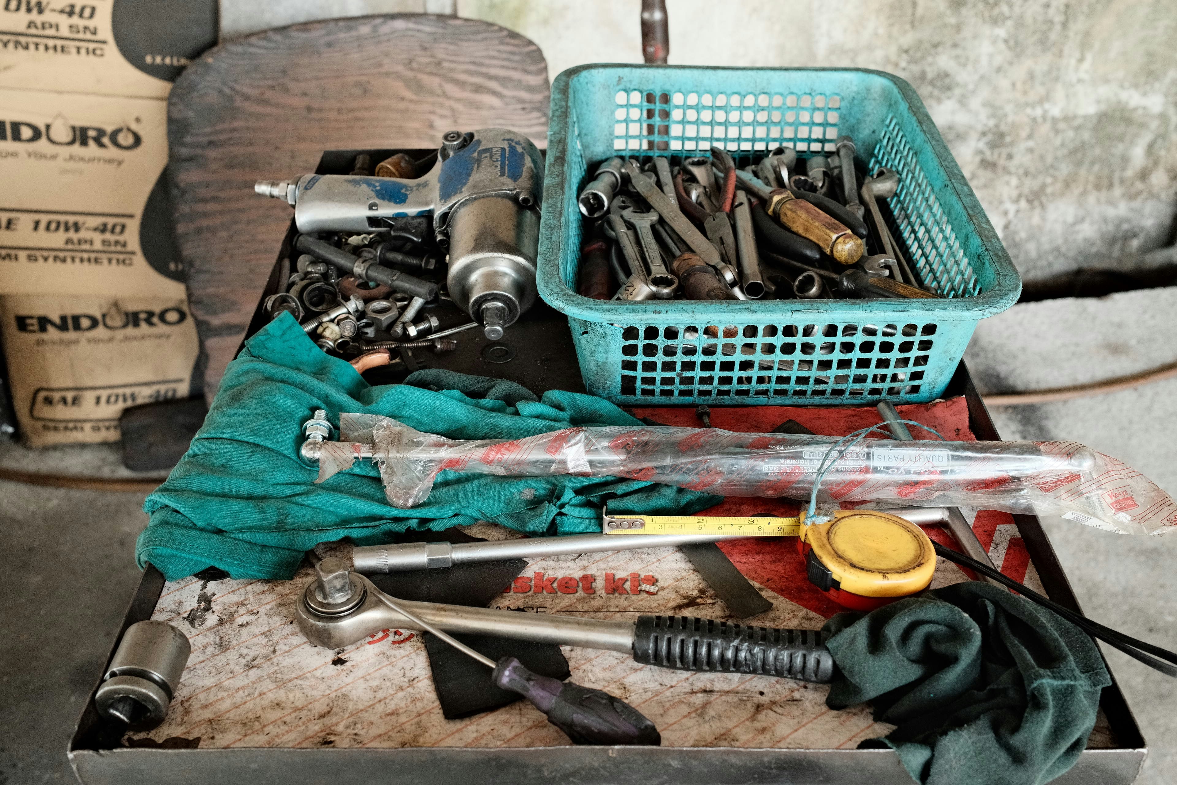 A cluttered workbench showcasing an array of tools and equipment, highlighting the essence of craftsmanship and repair work.