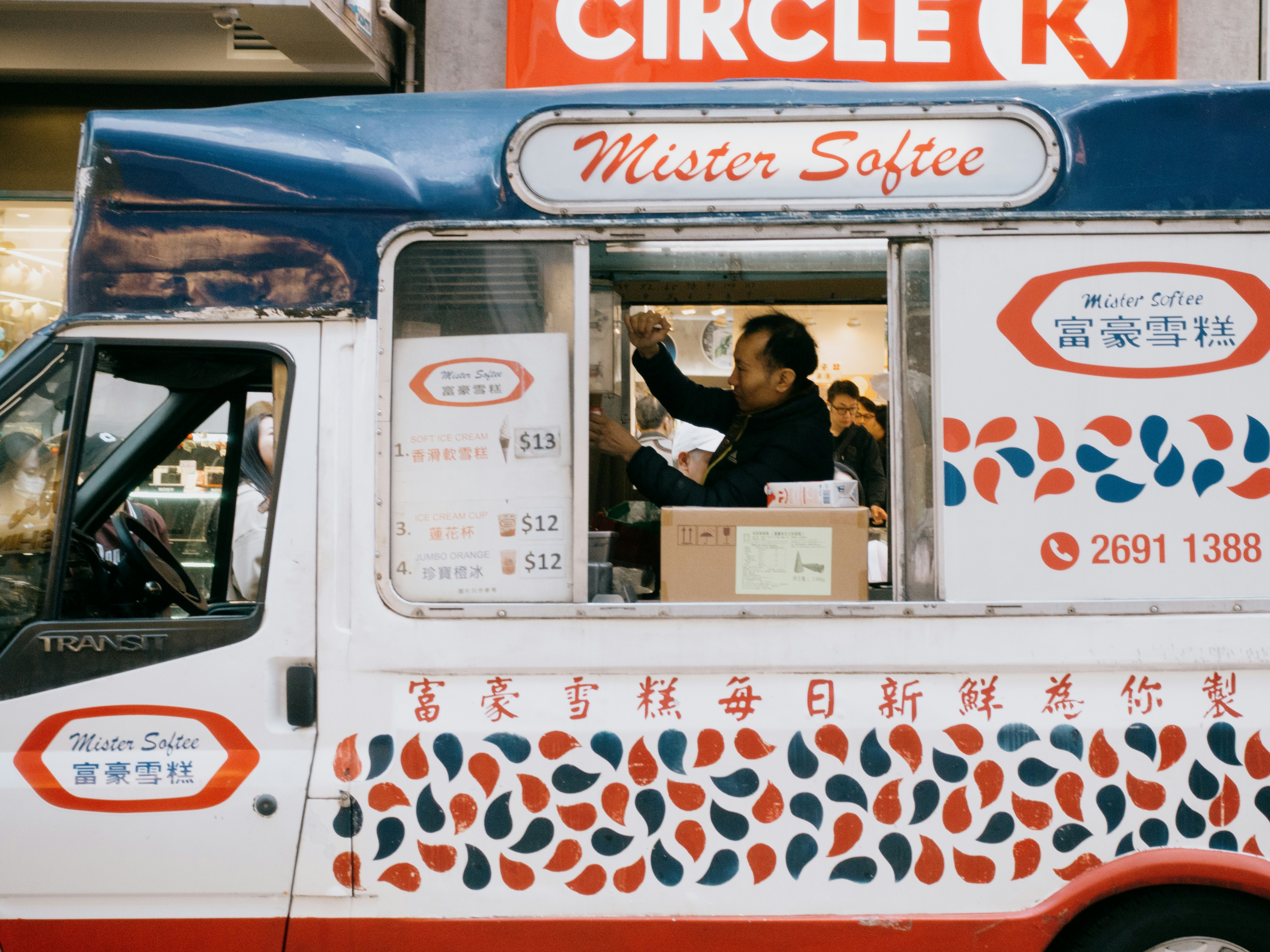 Mister Saftree: A Bus Stop Snack Moment Inside a Colorful Food Truck