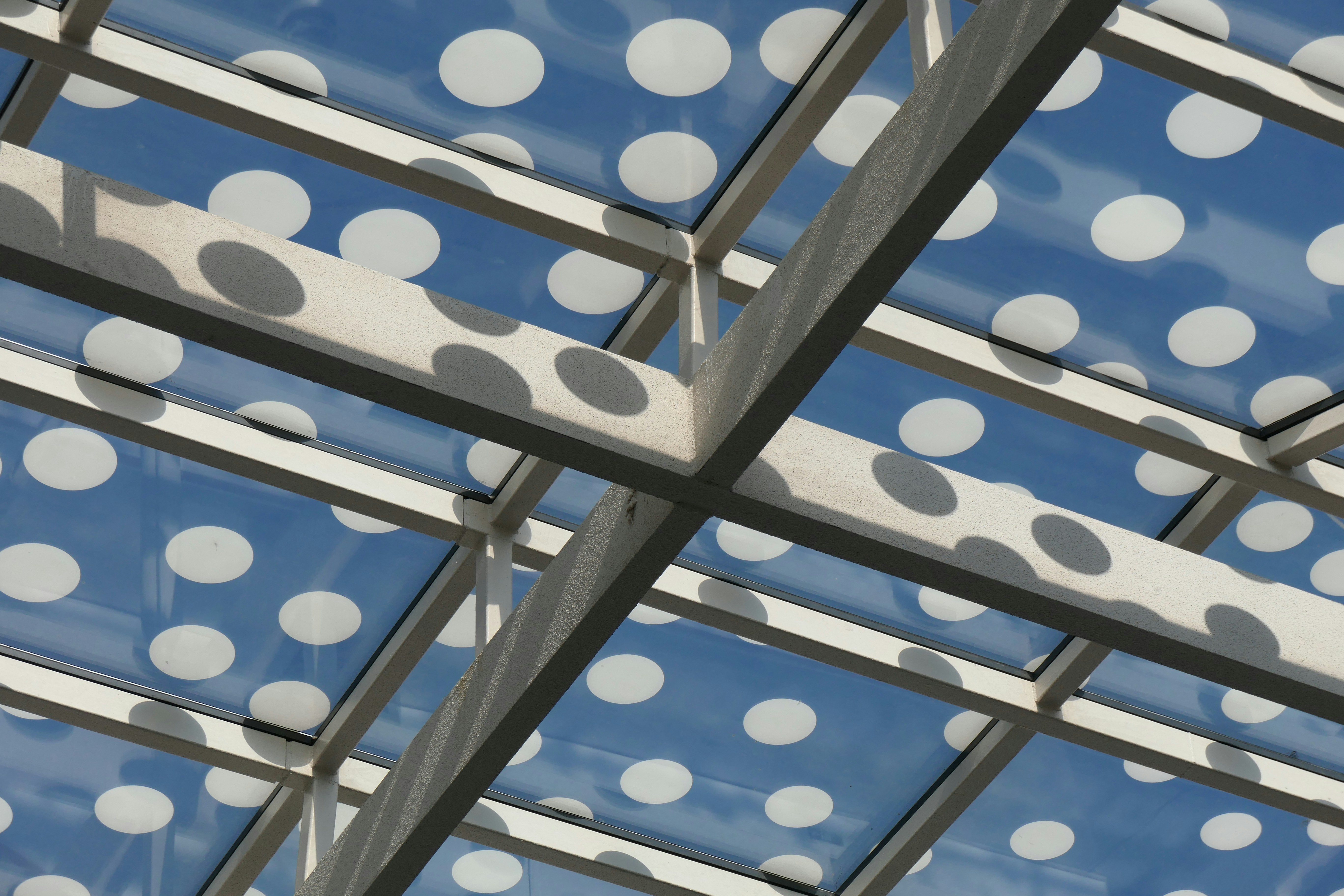 A close up of a metal structure with polka dots on it photo – Free Blue ...