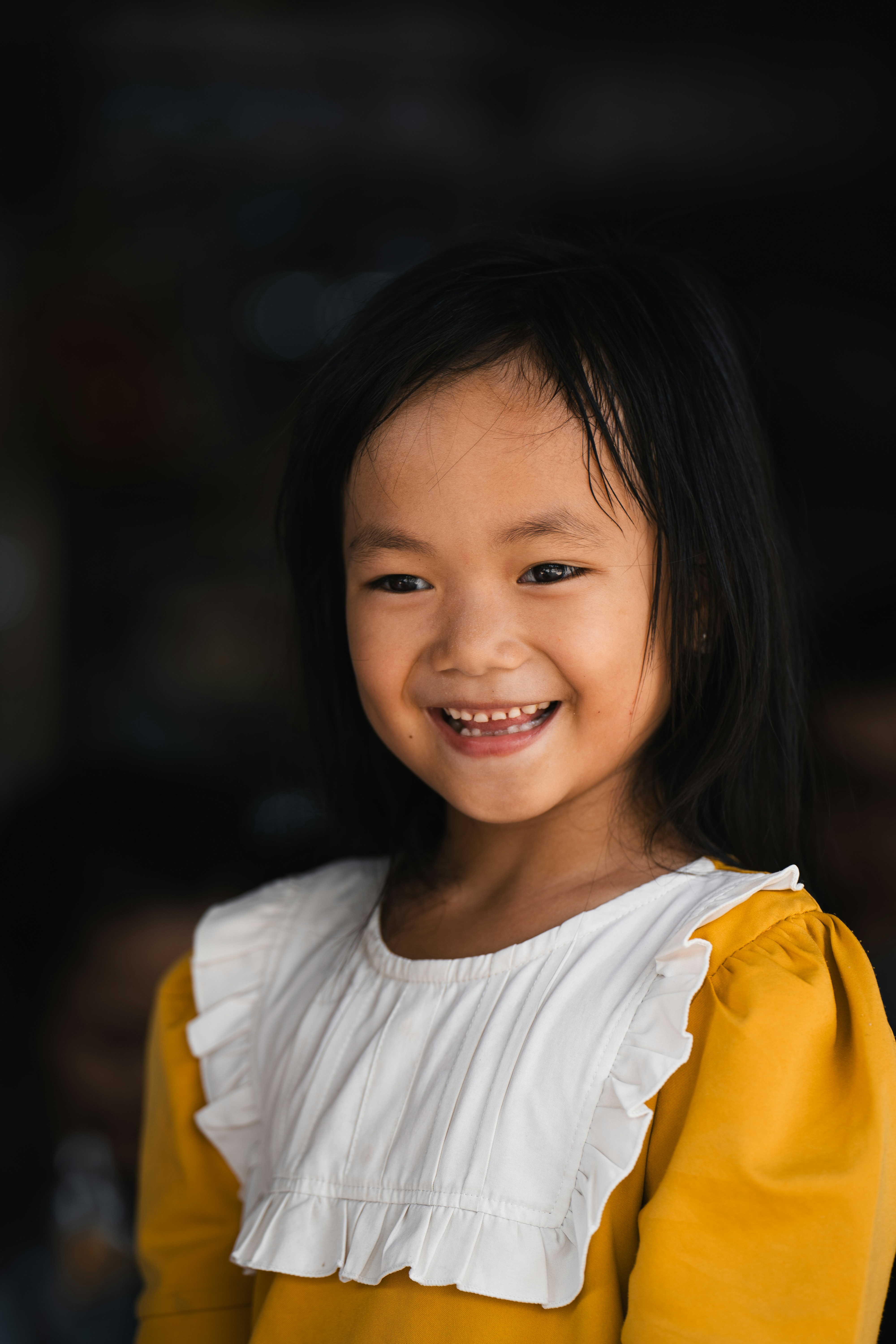 A little girl that is smiling for the camera photo – Free Portrait ...