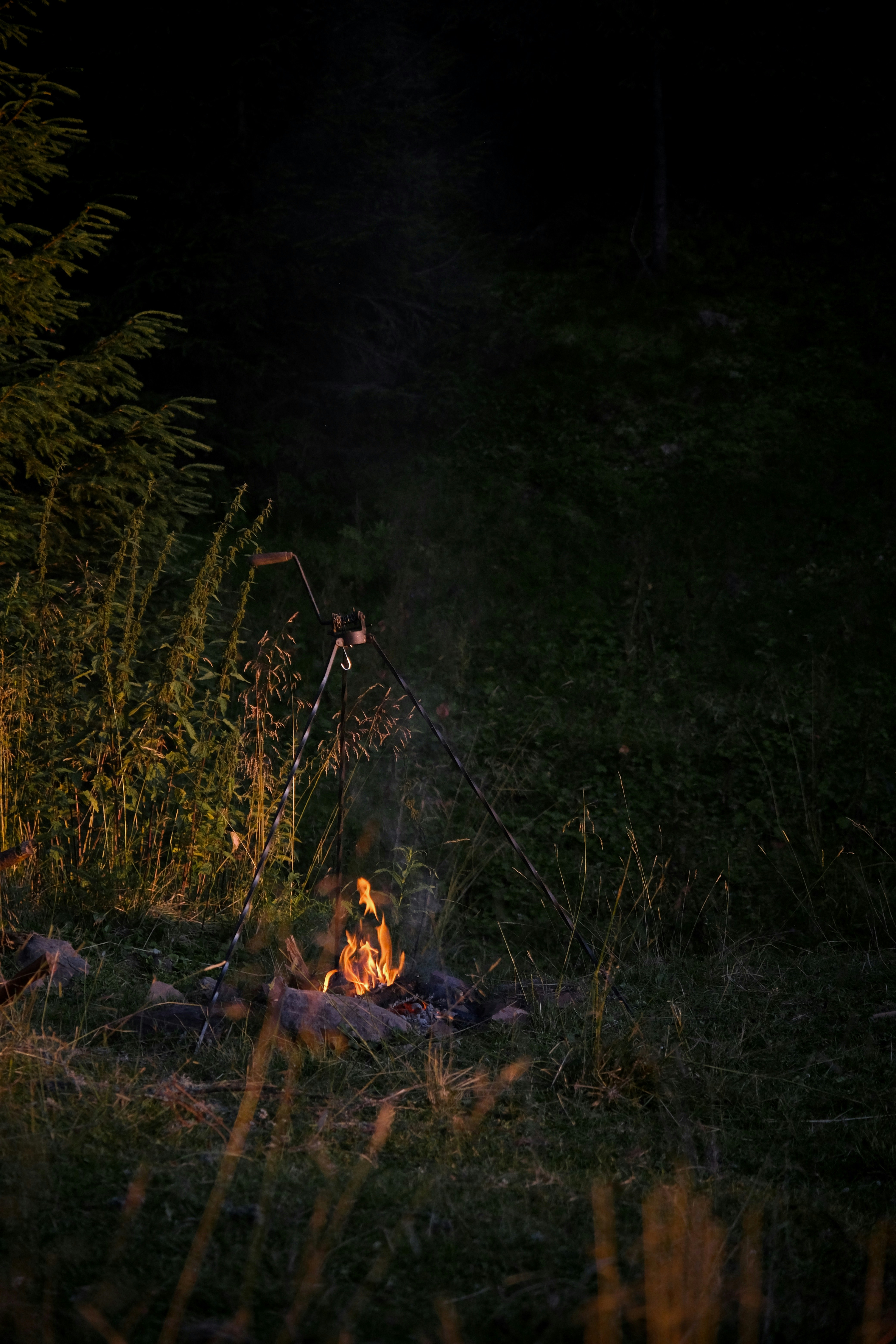 A campfire in the middle of a field at night photo – Free Summer Image ...