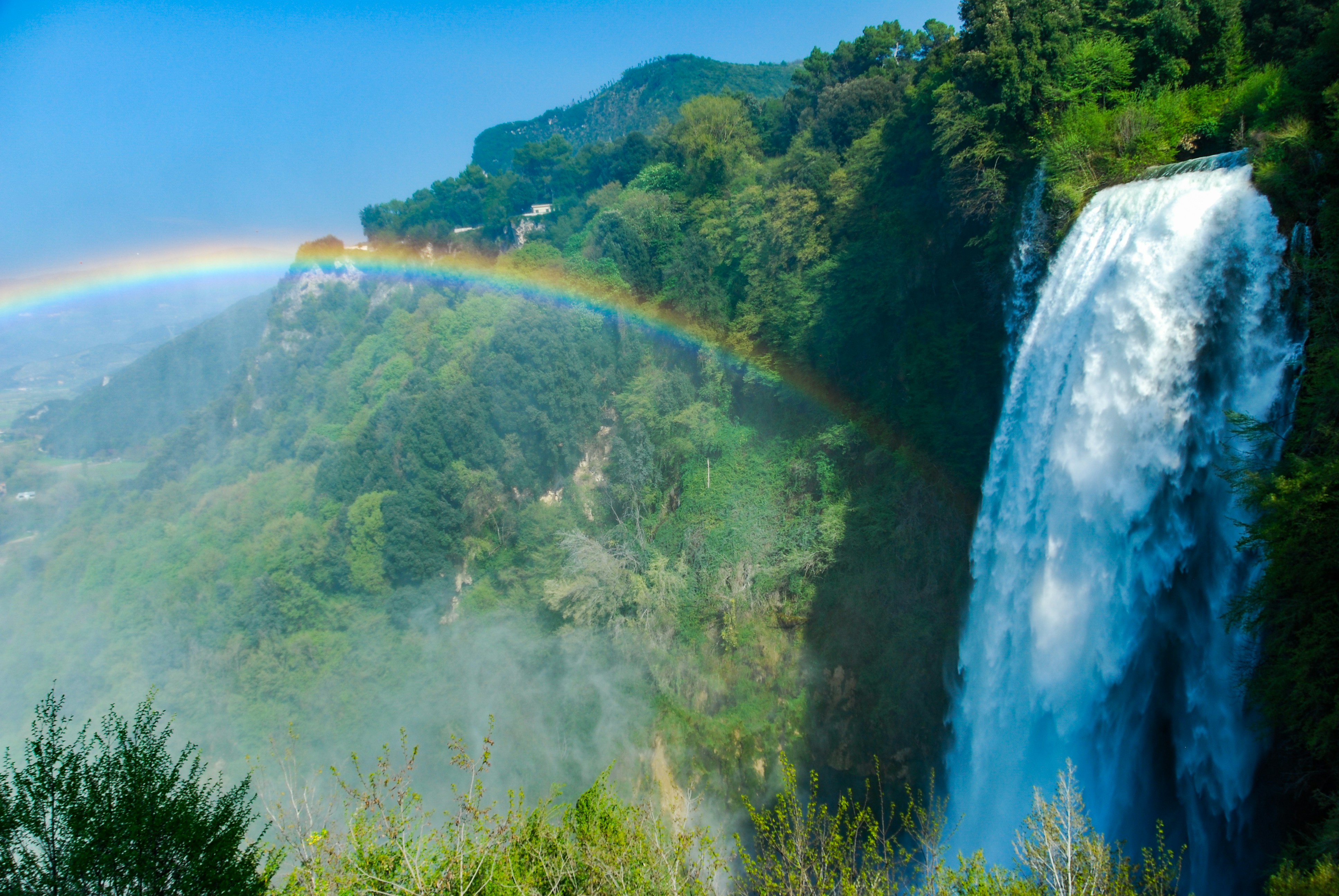 Arc of Serenity Over Verdant Cascade