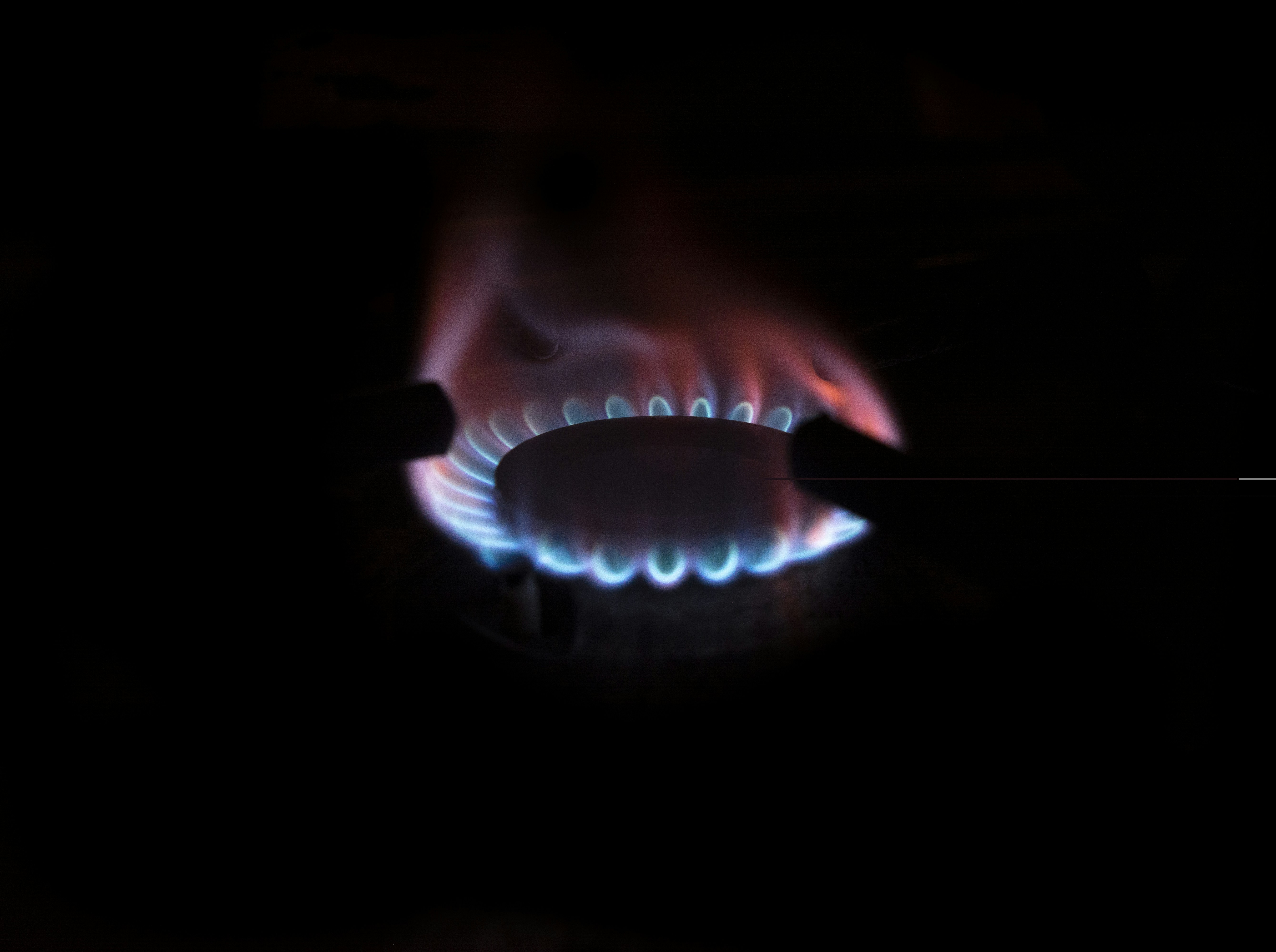 Central Flame: A Quiet Portrait of a Gas Burner in Darkness