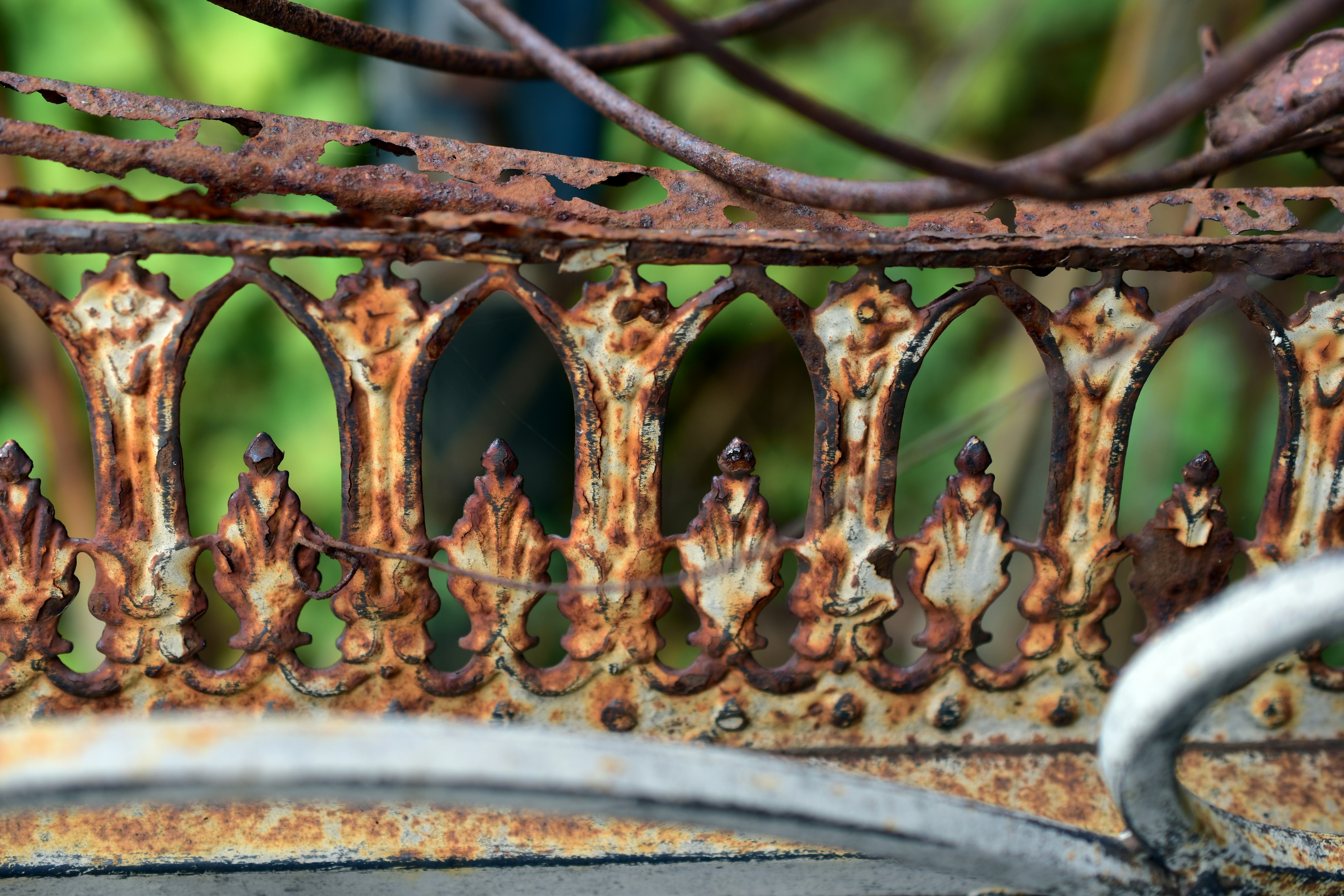 Rust Mosaic: Close-Up of a Weathered Ornamental Grate