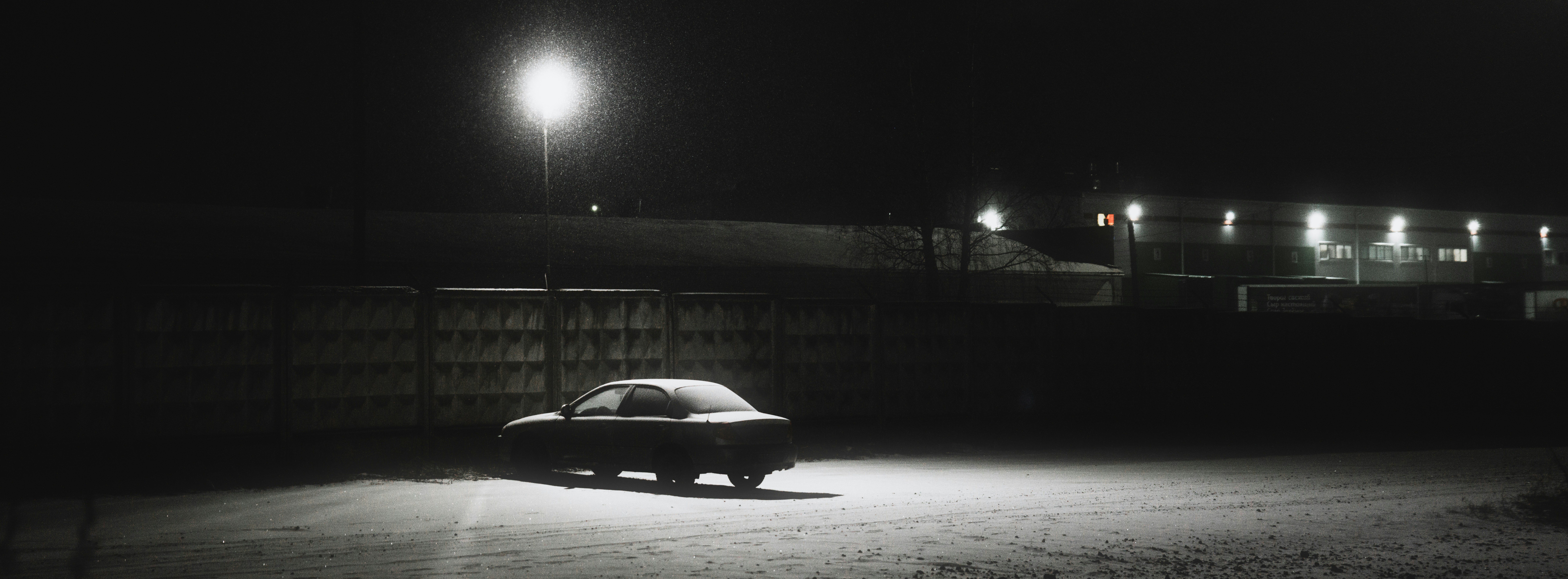 Midnight Sedan Beneath a Solitary Streetlamp