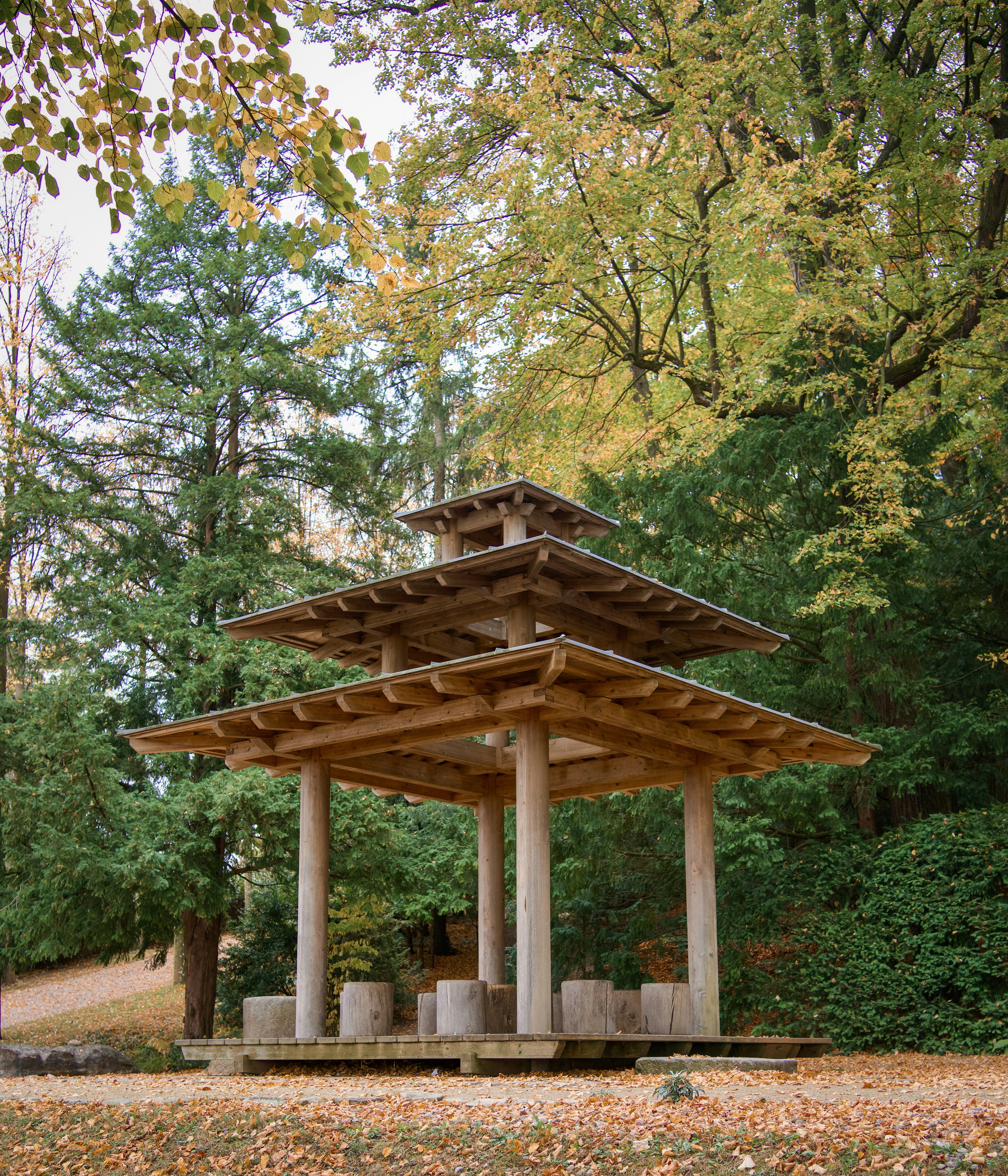 Three-Tier Timber Pavilion Beneath an Autumn Canopy