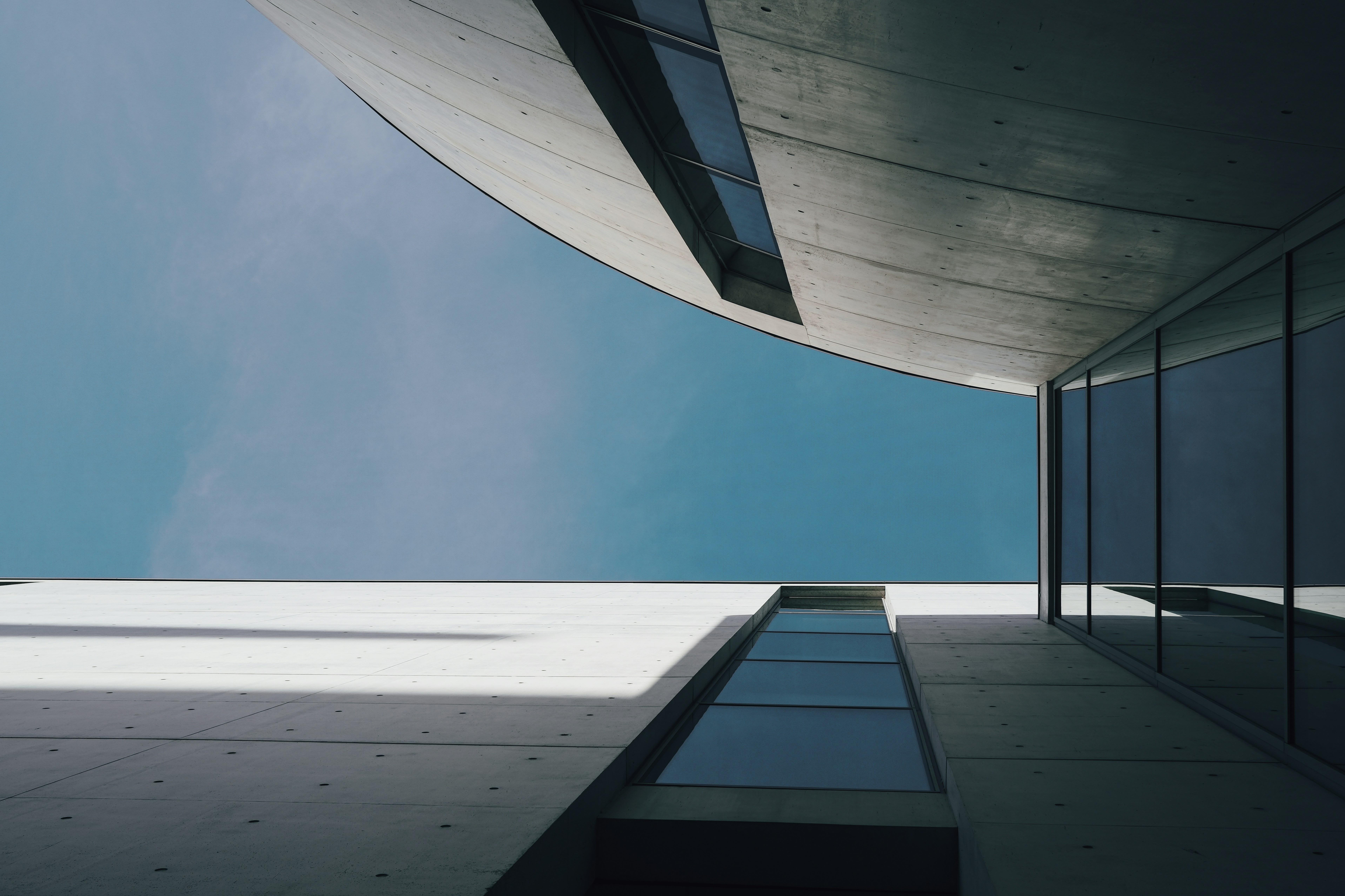 A large building with a sky view from the ground photo – Free Library ...