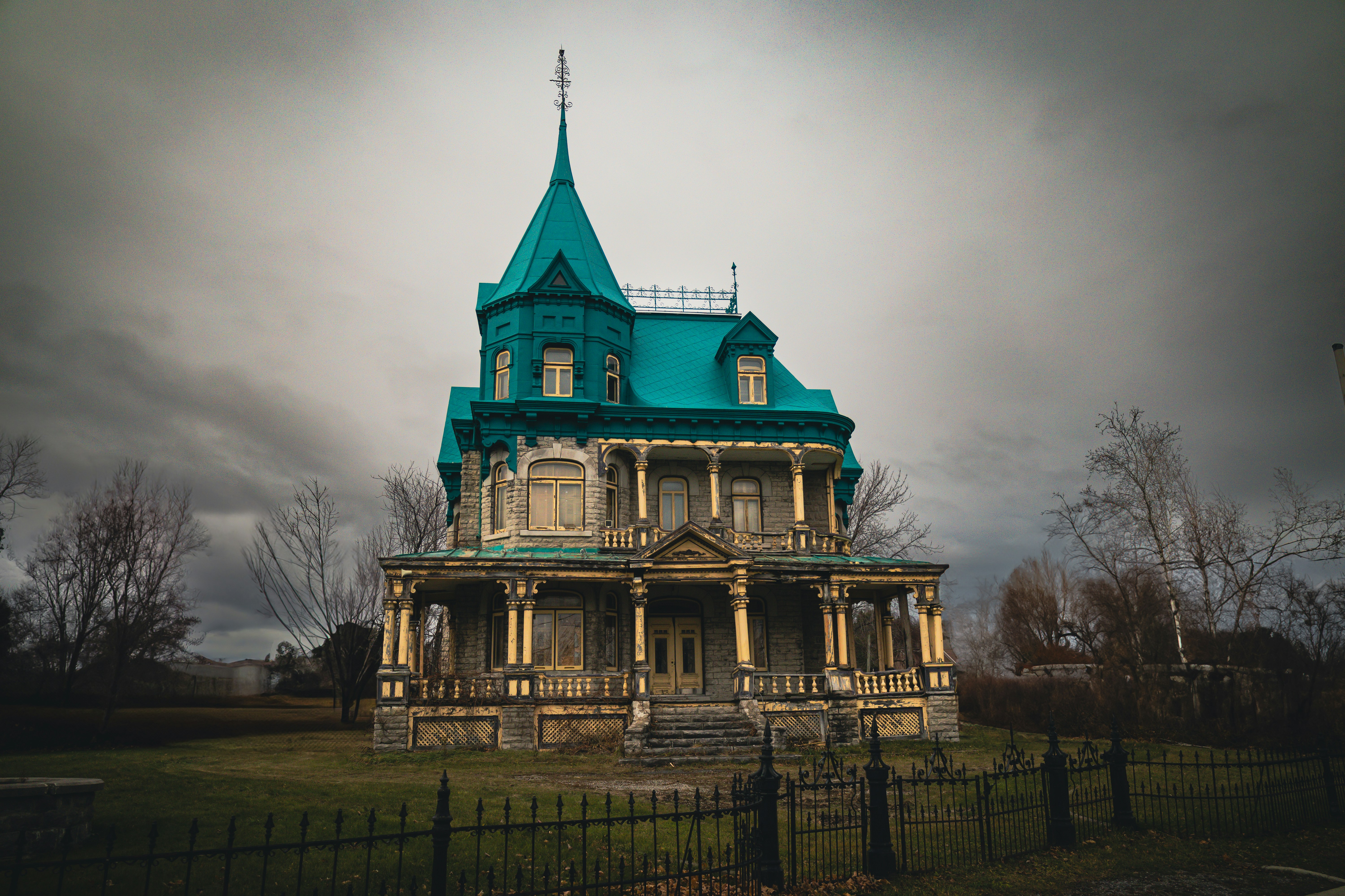 Majestic Turquoise Manor Under Brooding Skies